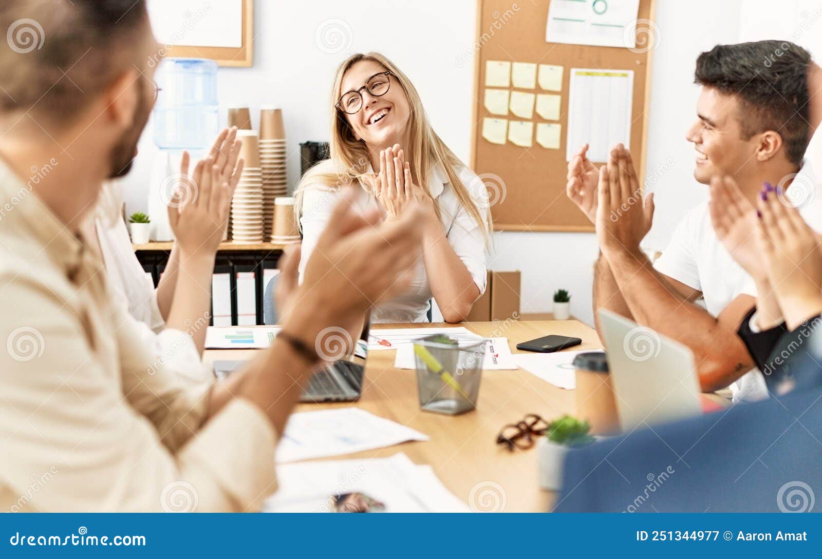 Group of Young Business Workers Smiling and Clapping To Partner at the ...