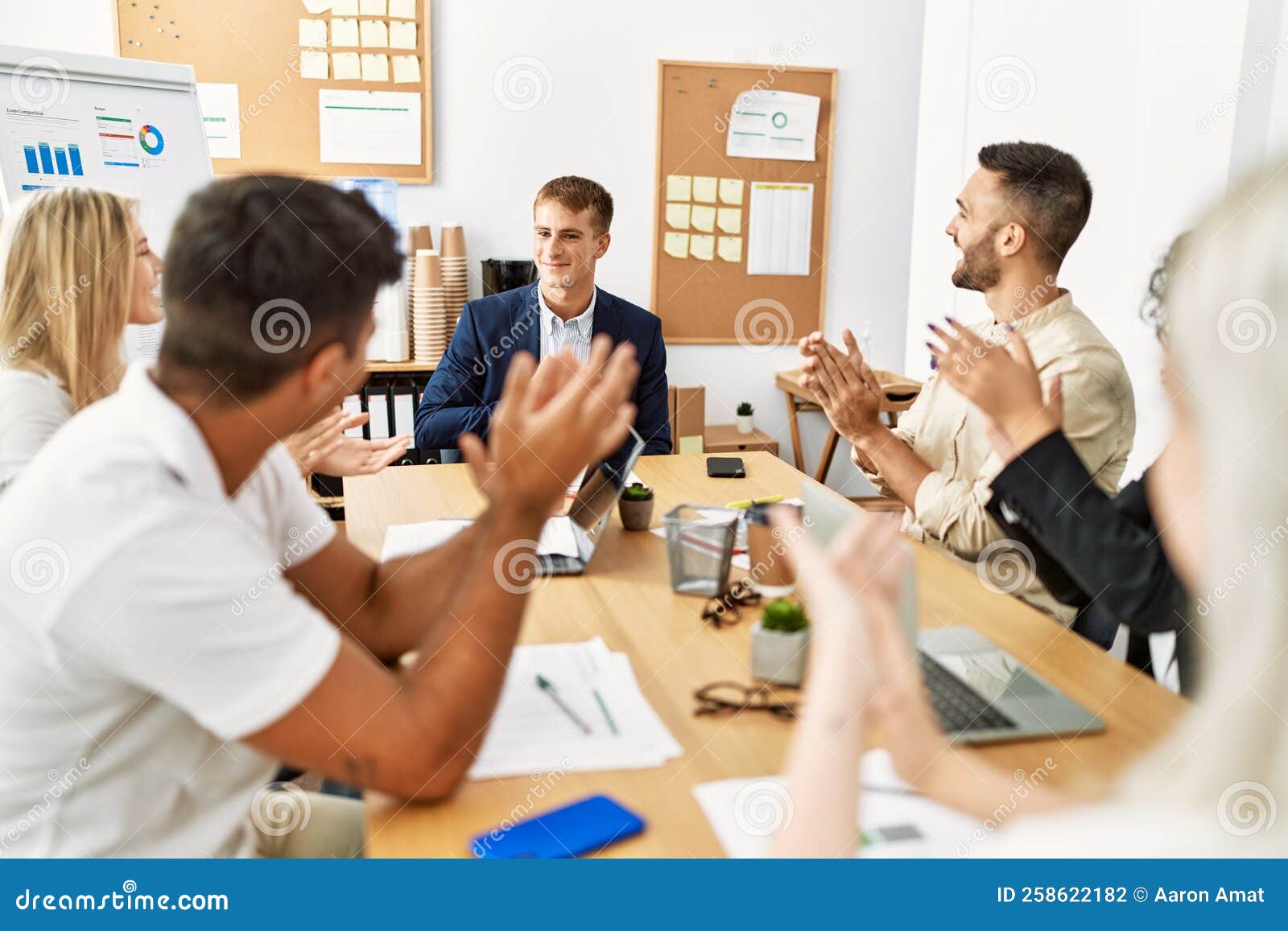 Group of Young Business Workers Smiling and Clapping To Partner at the ...
