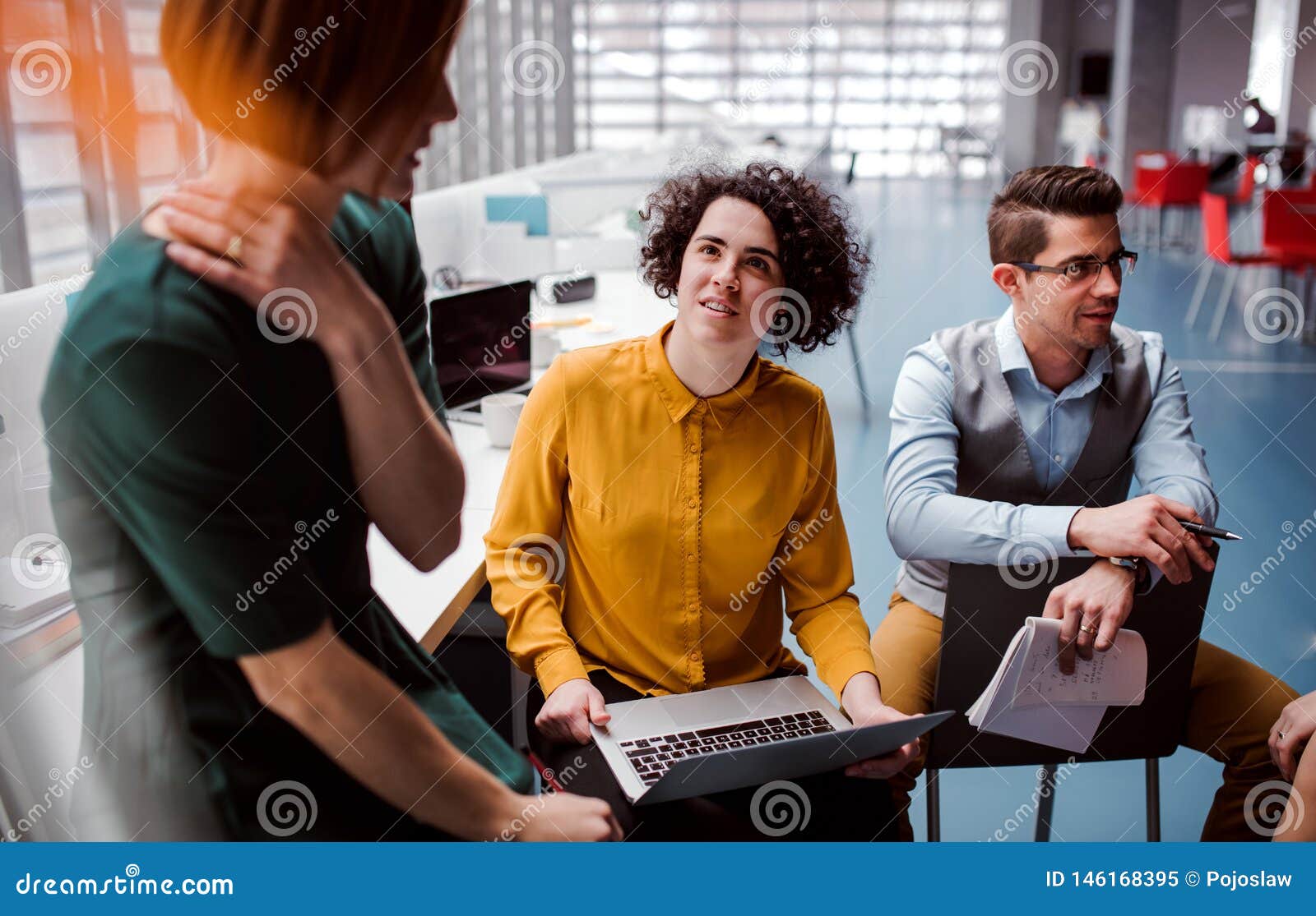 Group of Young Businesspeople Working Together in Office, Talking ...