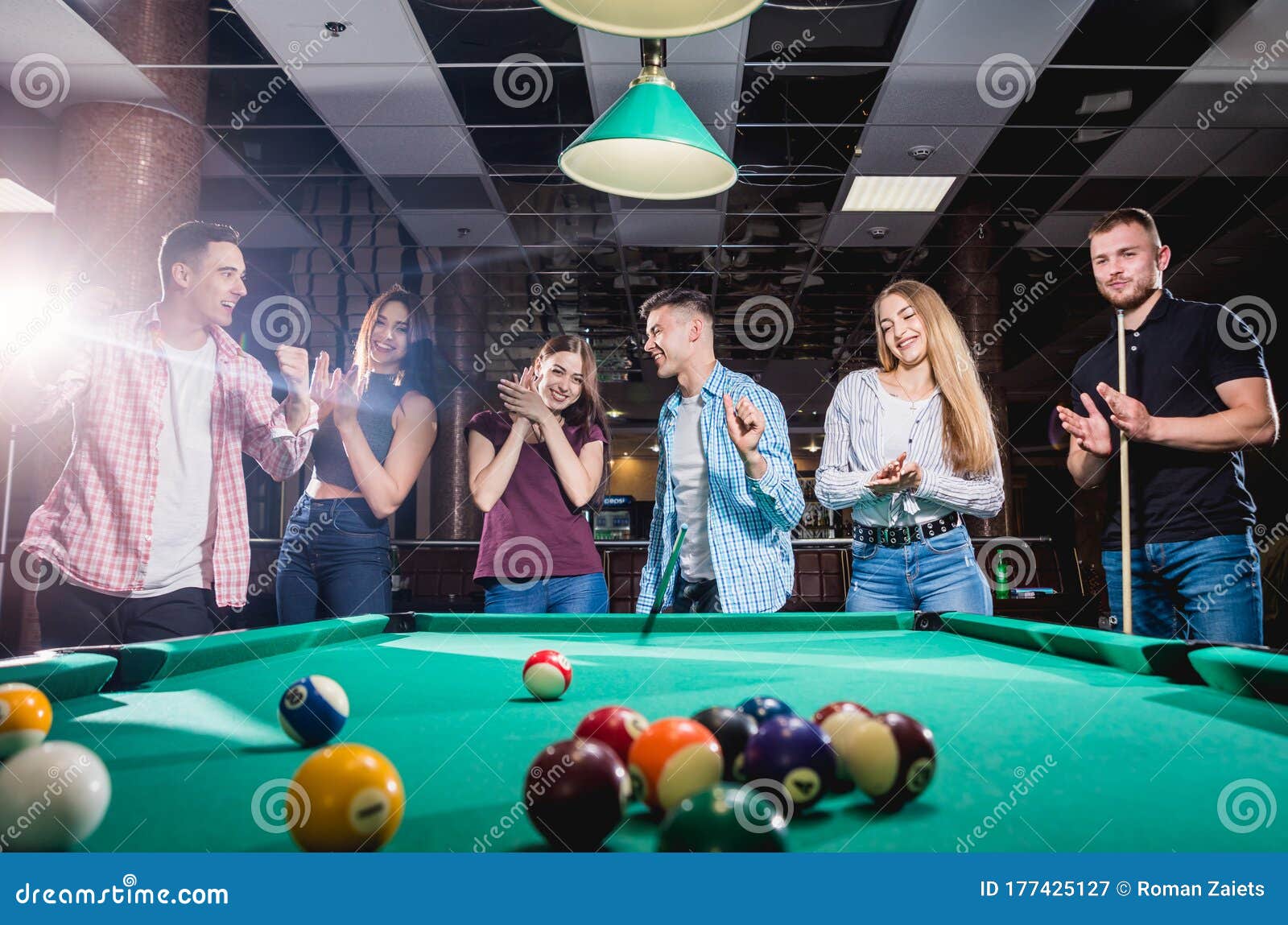 Group of Young Cheerful Friends Playing Billiards. Stock Image - Image ...