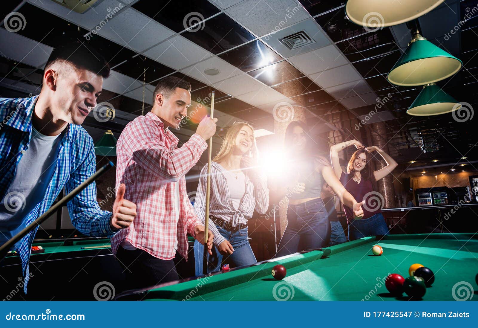 Group of Young Cheerful Friends Playing Billiards. Stock Image - Image ...