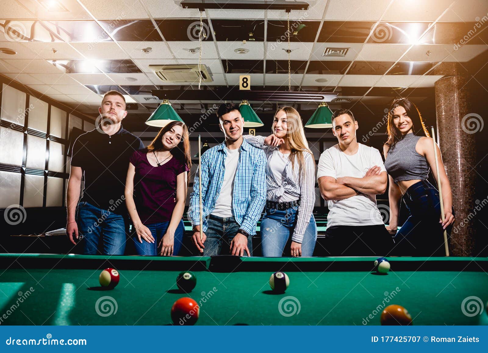 Group of Young Cheerful Friends Playing Billiards. Stock Image - Image ...