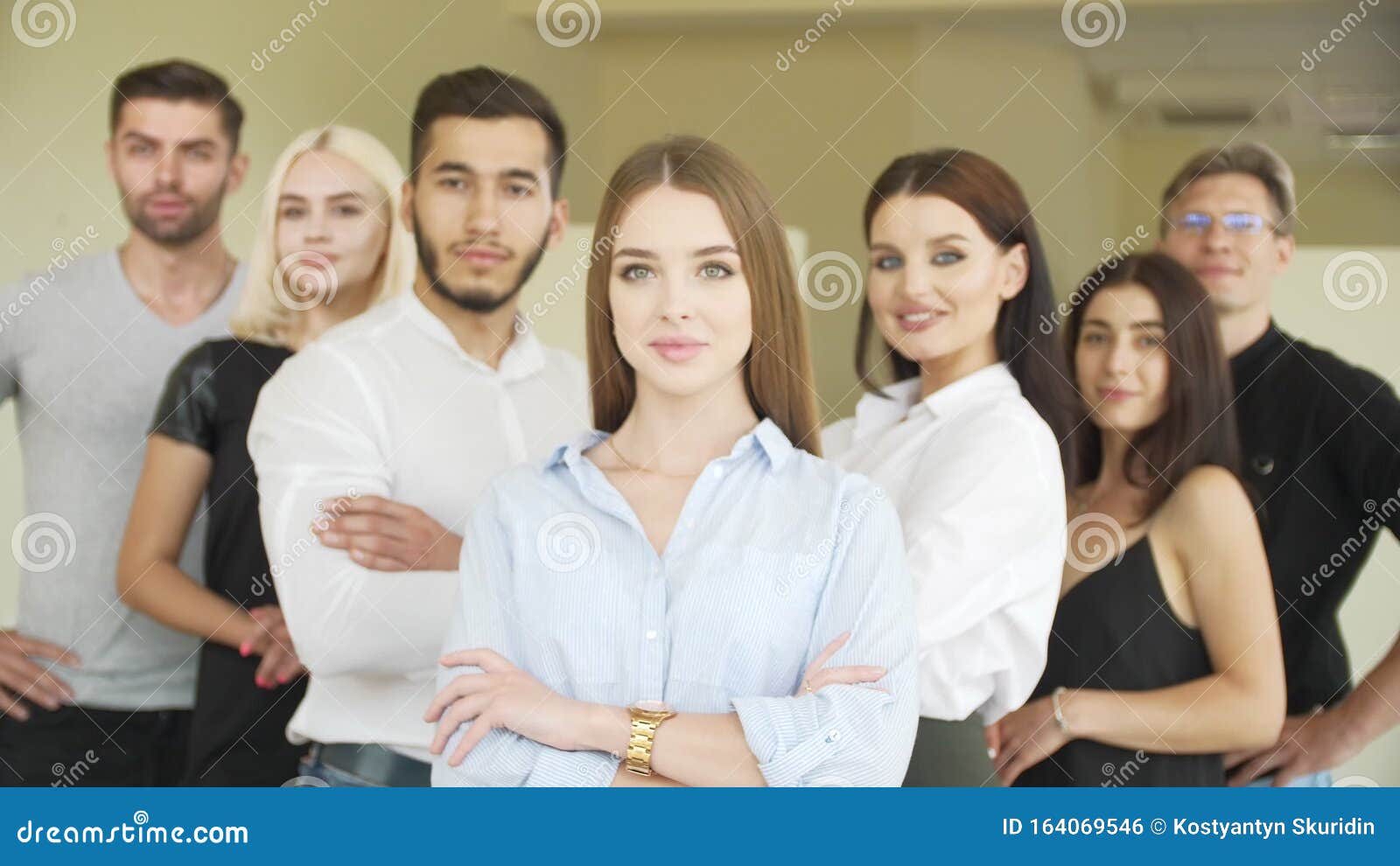 A Group of Young Cheerful People are Looking Forward and Up they are ...