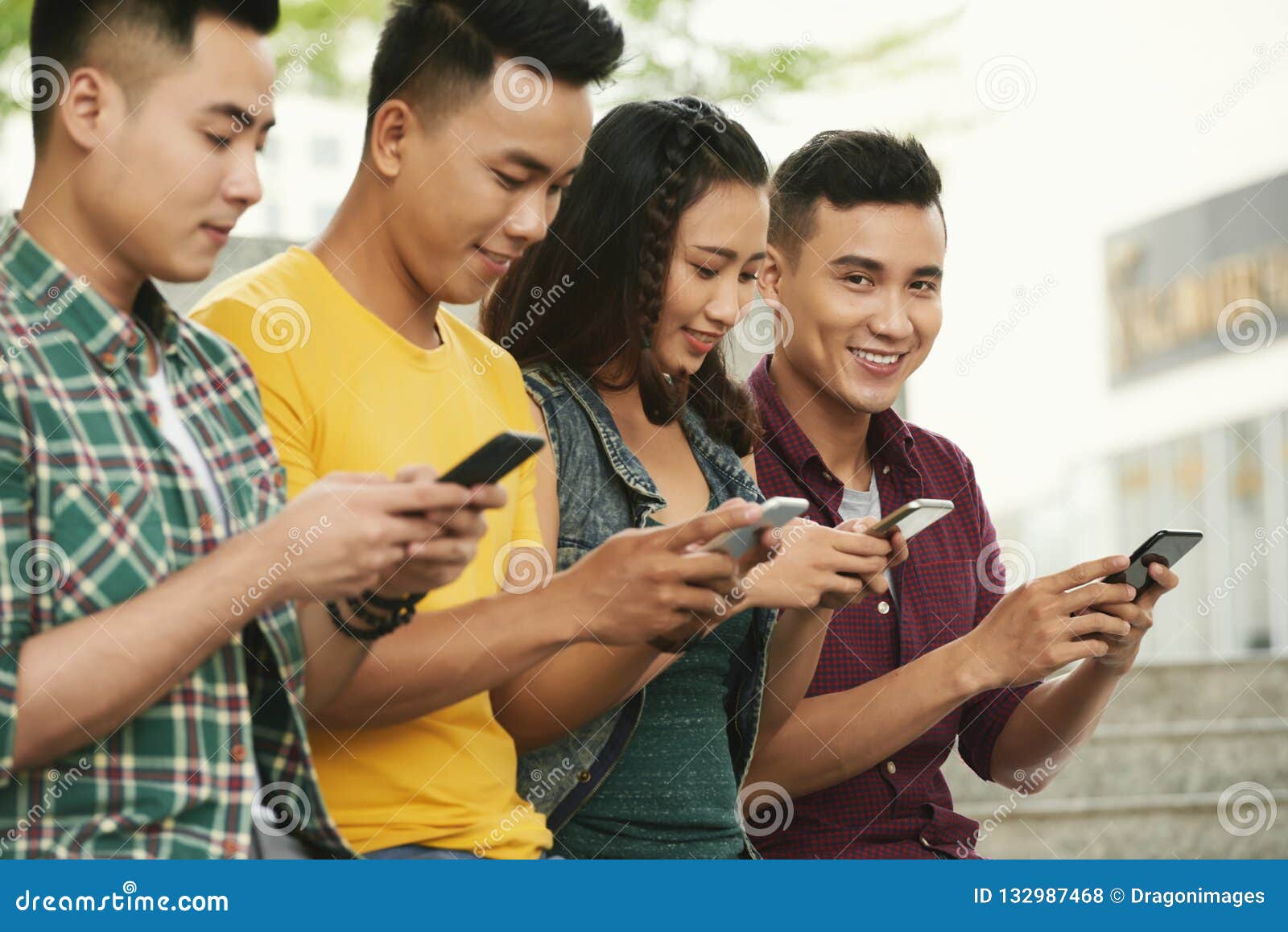Young People Texting Each Other Stock Photo - Image of asian, outdoor ... Young People Texting Each Other Stock Photo - Image of asian, outdoor ...