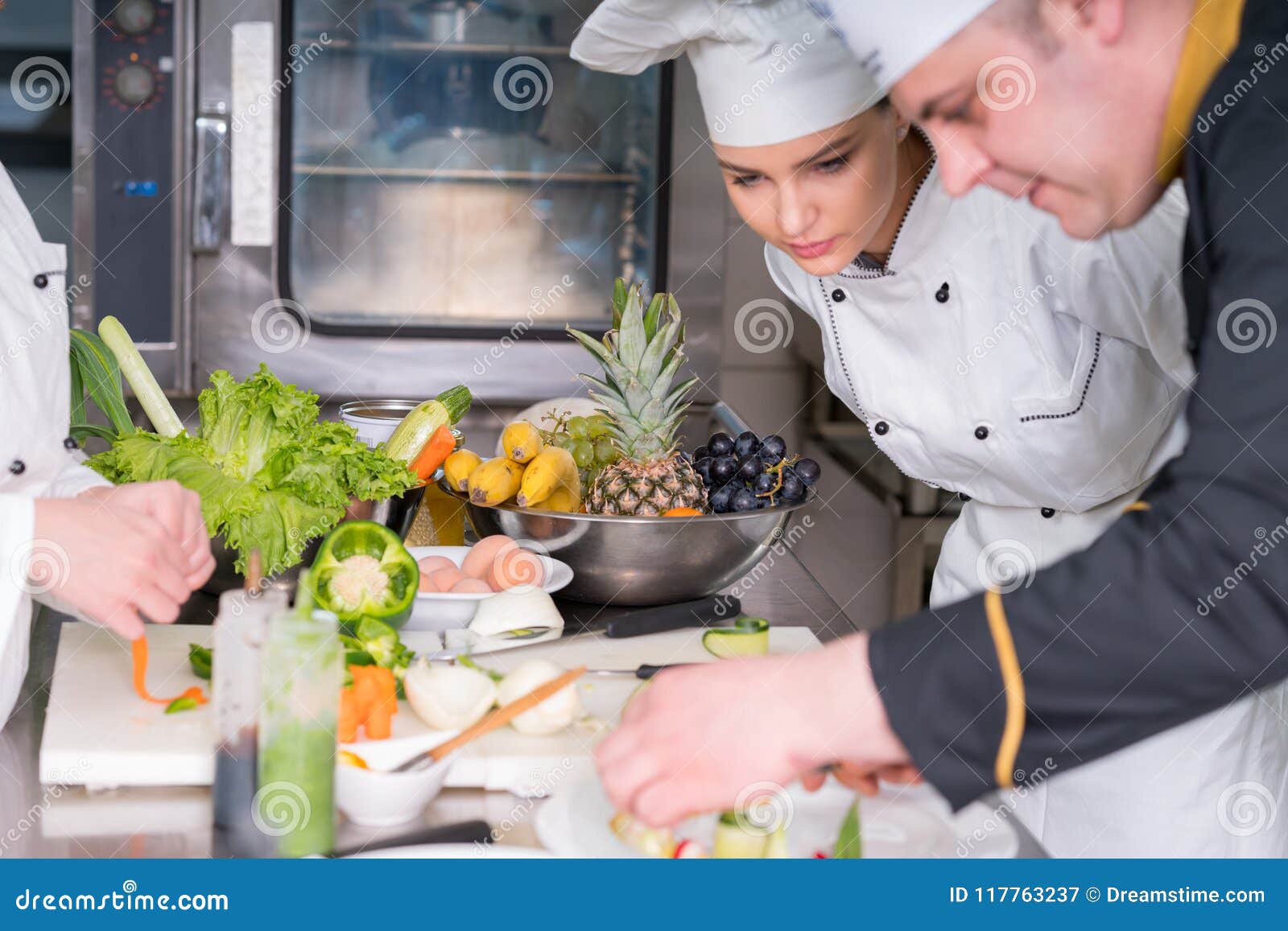 A Group of Young Chefs Prepairing Meal in Luxury Restaurant Stock Image ...