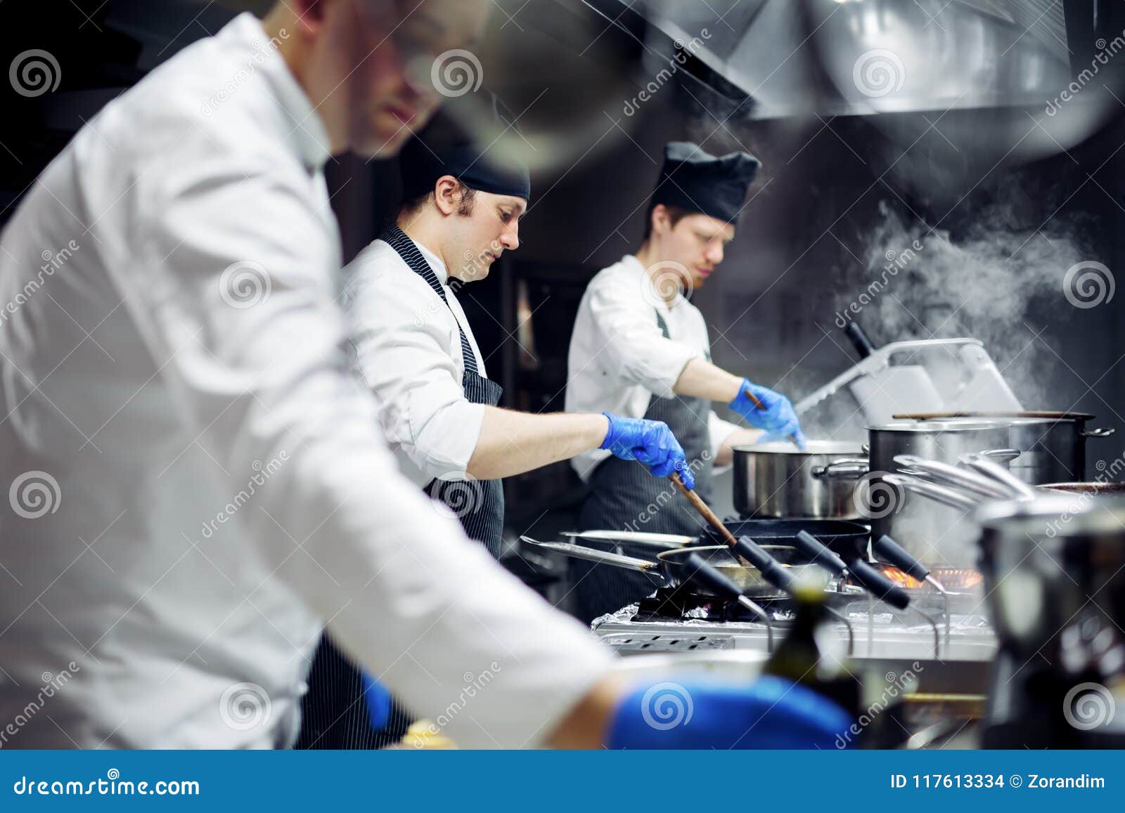 Group of Chefs Working in the Kitchen Stock Photo - Image of iron ...