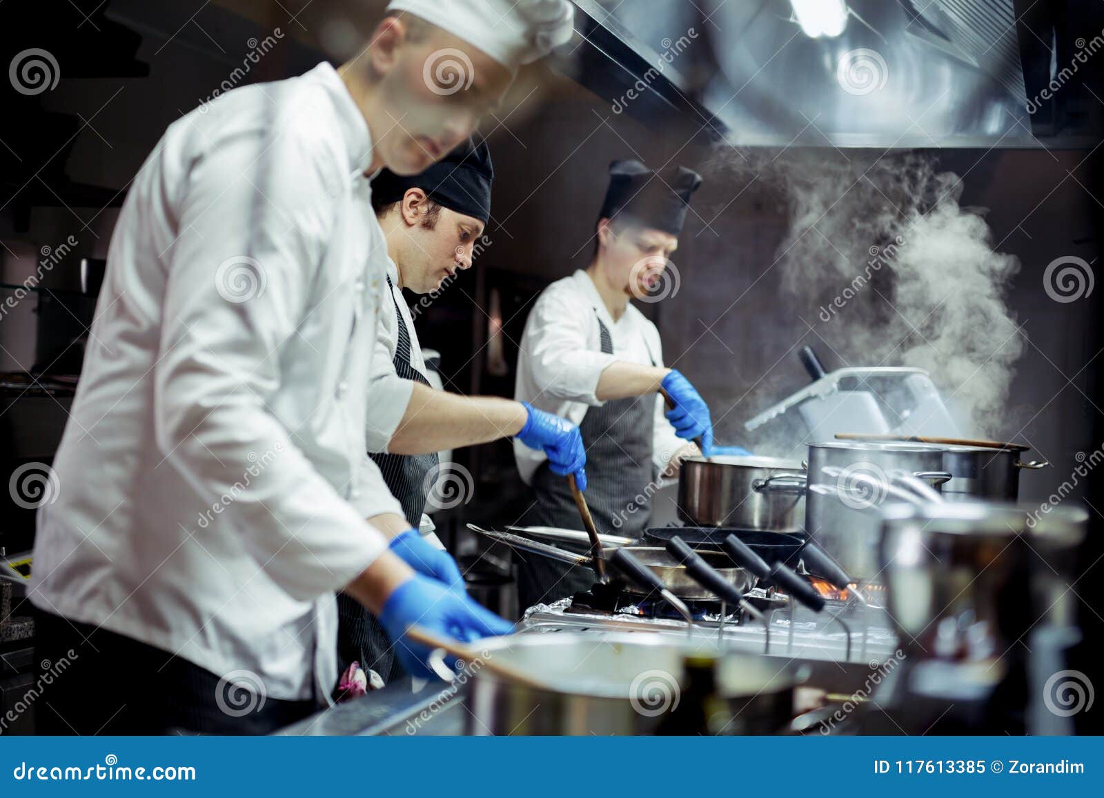 Group of Chefs Working in the Kitchen Stock Image - Image of equipment ...