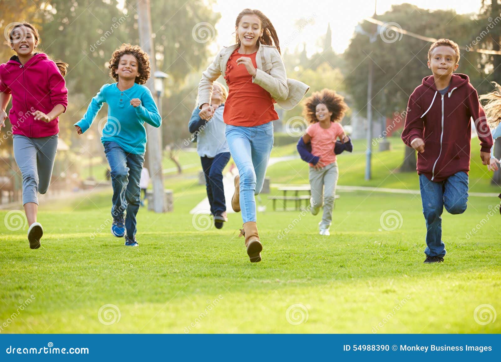 Group of Young Children Running Towards Camera in Park Stock Photo ...