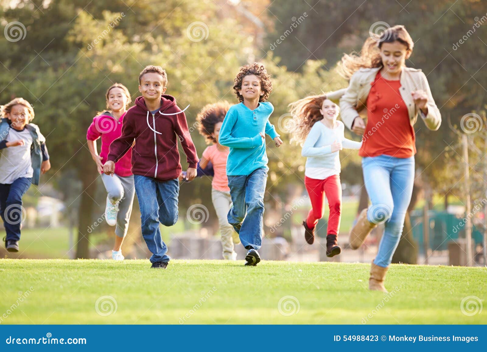 Group of Young Children Running Towards Camera in Park Stock Image ...