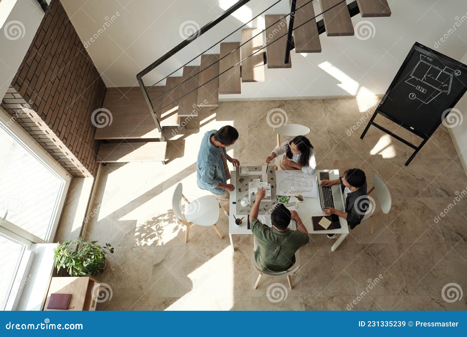 Group of Young Chinese Architects Gathered by Table for Discussion of ...