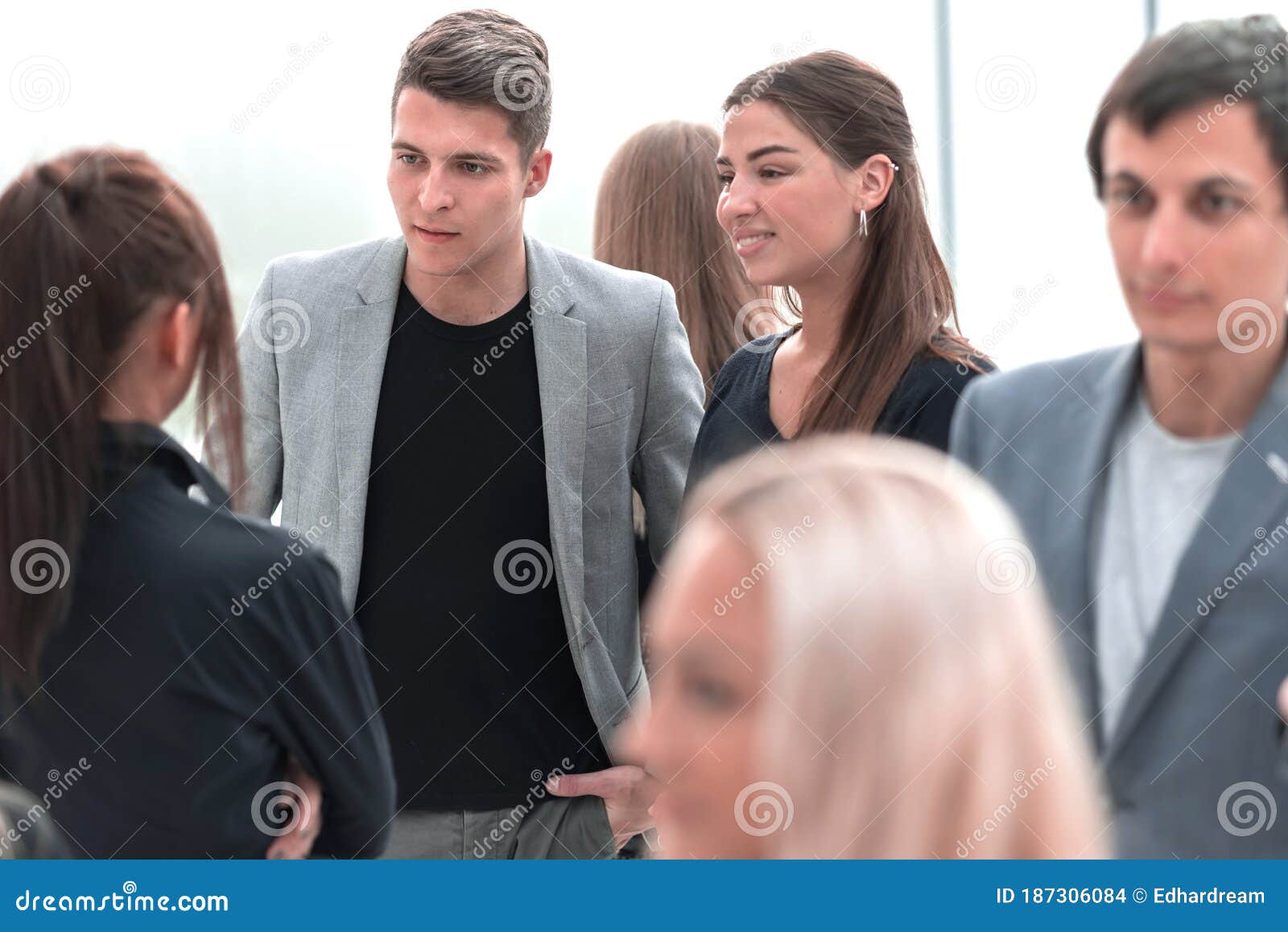 Group of Young Colleagues Talking Standing in the Office Stock Photo ...