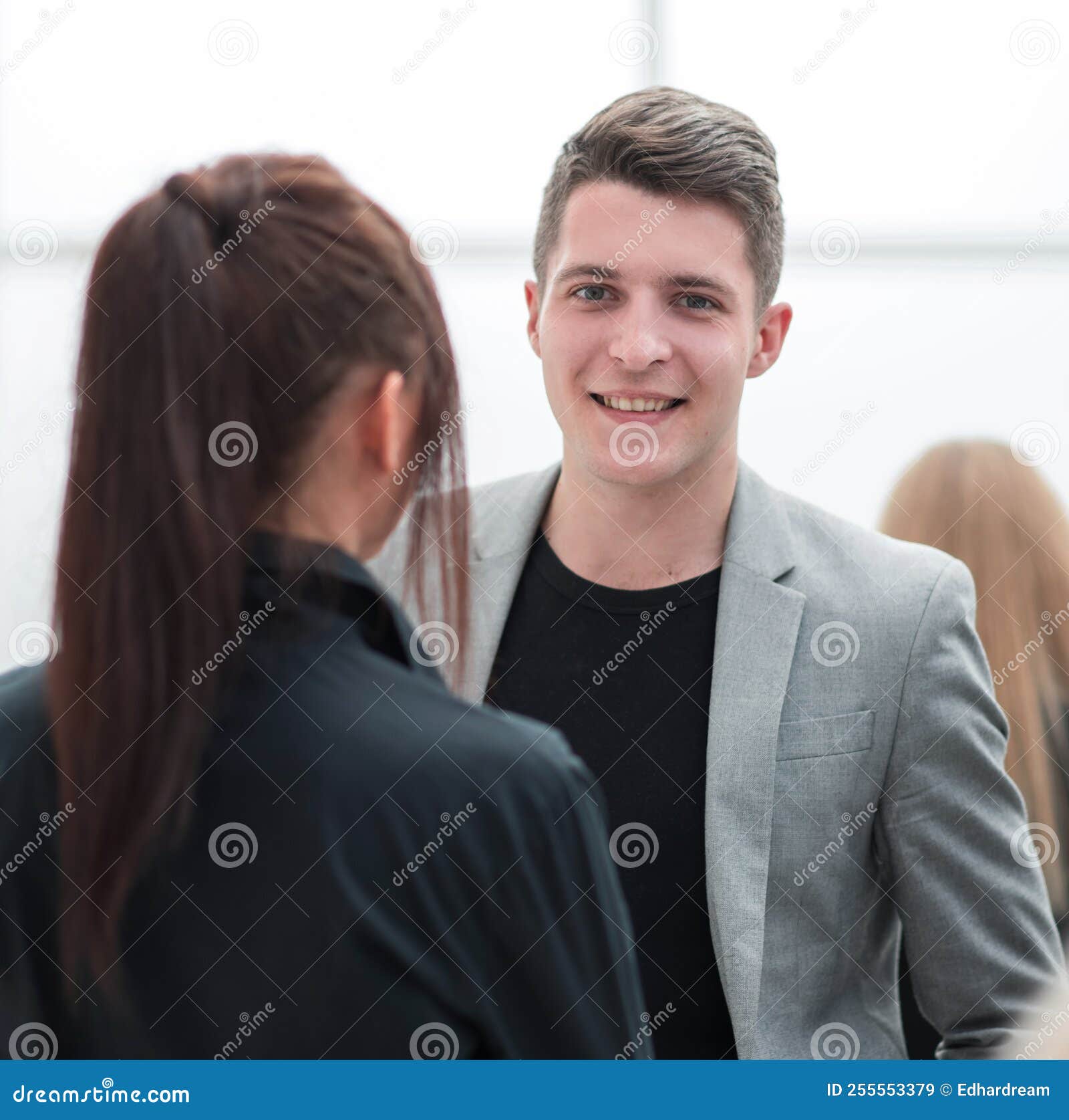 Group of Young Colleagues Talking Standing in the Office Stock Image ...