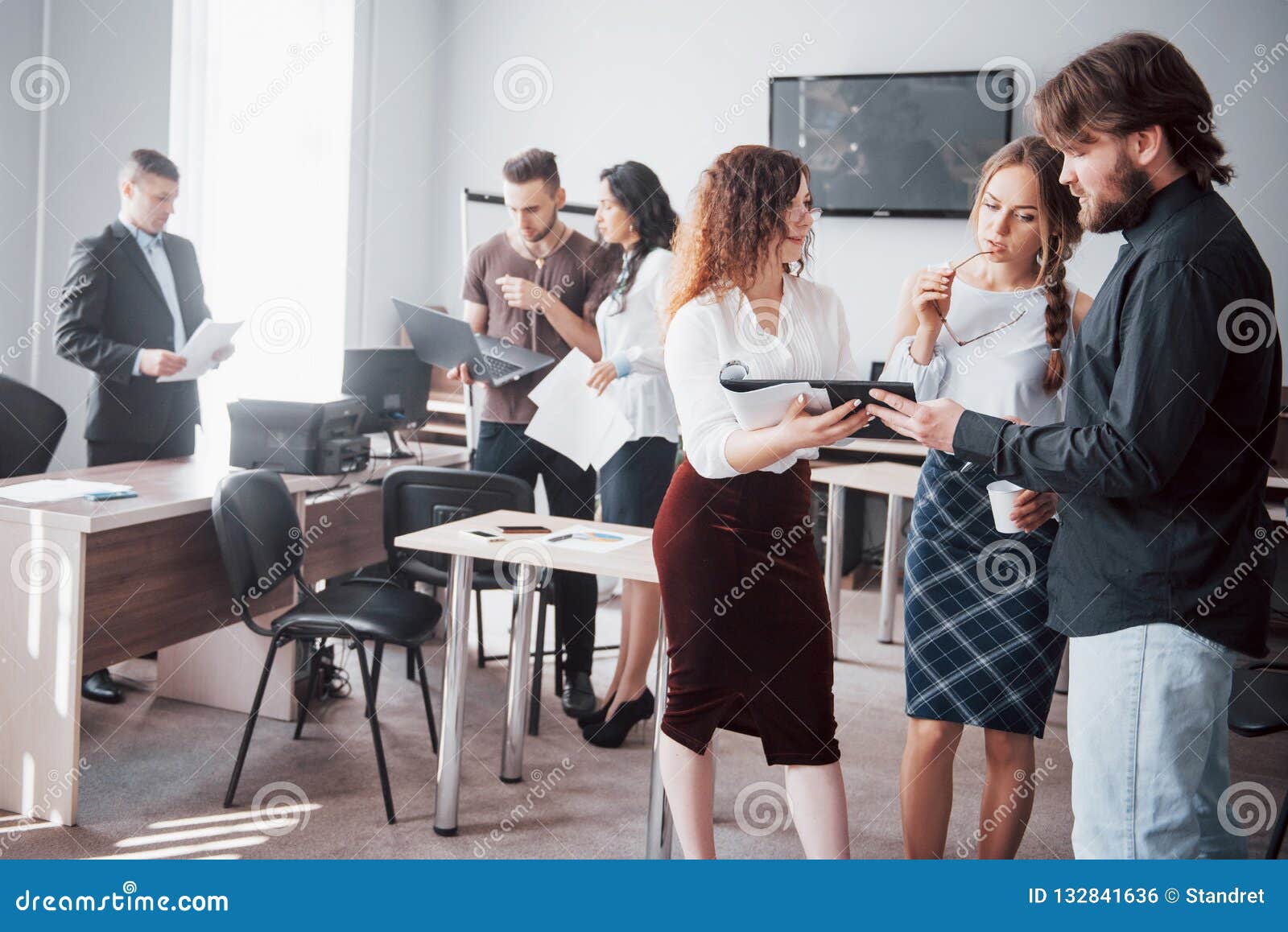 A Group of Young Colleagues Talks about Working Issues in Modern Office ...