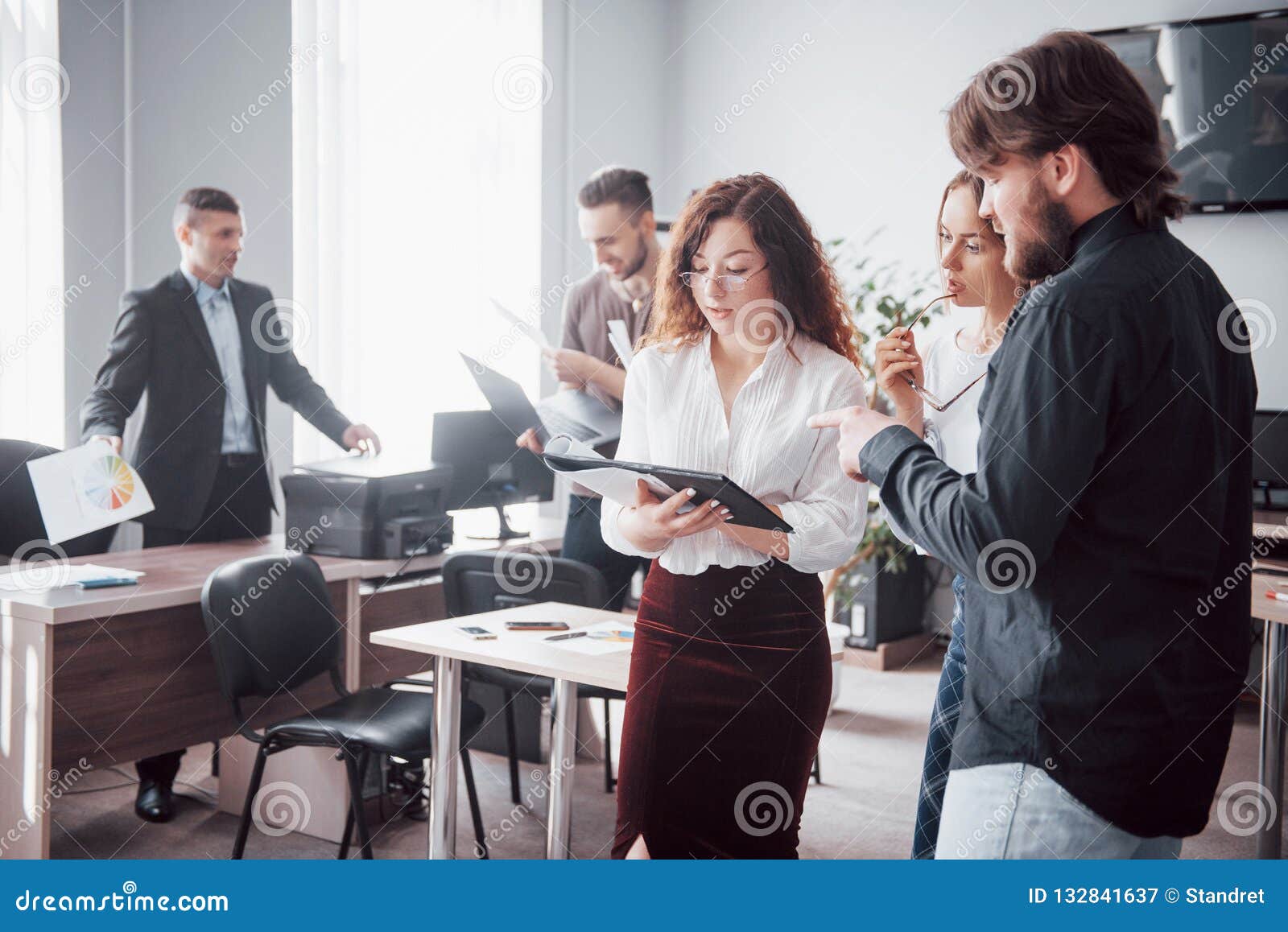 A Group of Young Colleagues Talks about Working Issues in Modern Office ...