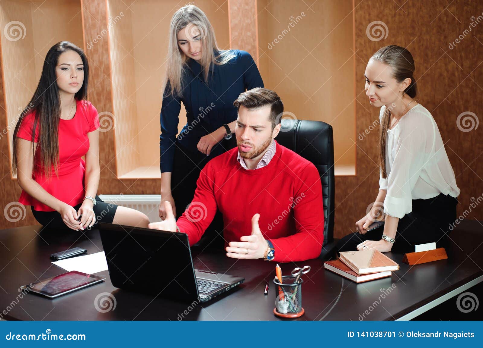 Group of Young Colleagues Using Laptop at Office. Stock Image - Image ...