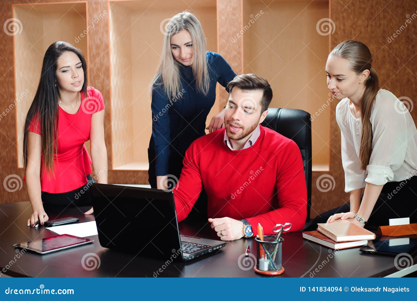 Group of Young Colleagues Using Laptop at Office. Stock Photo - Image ...