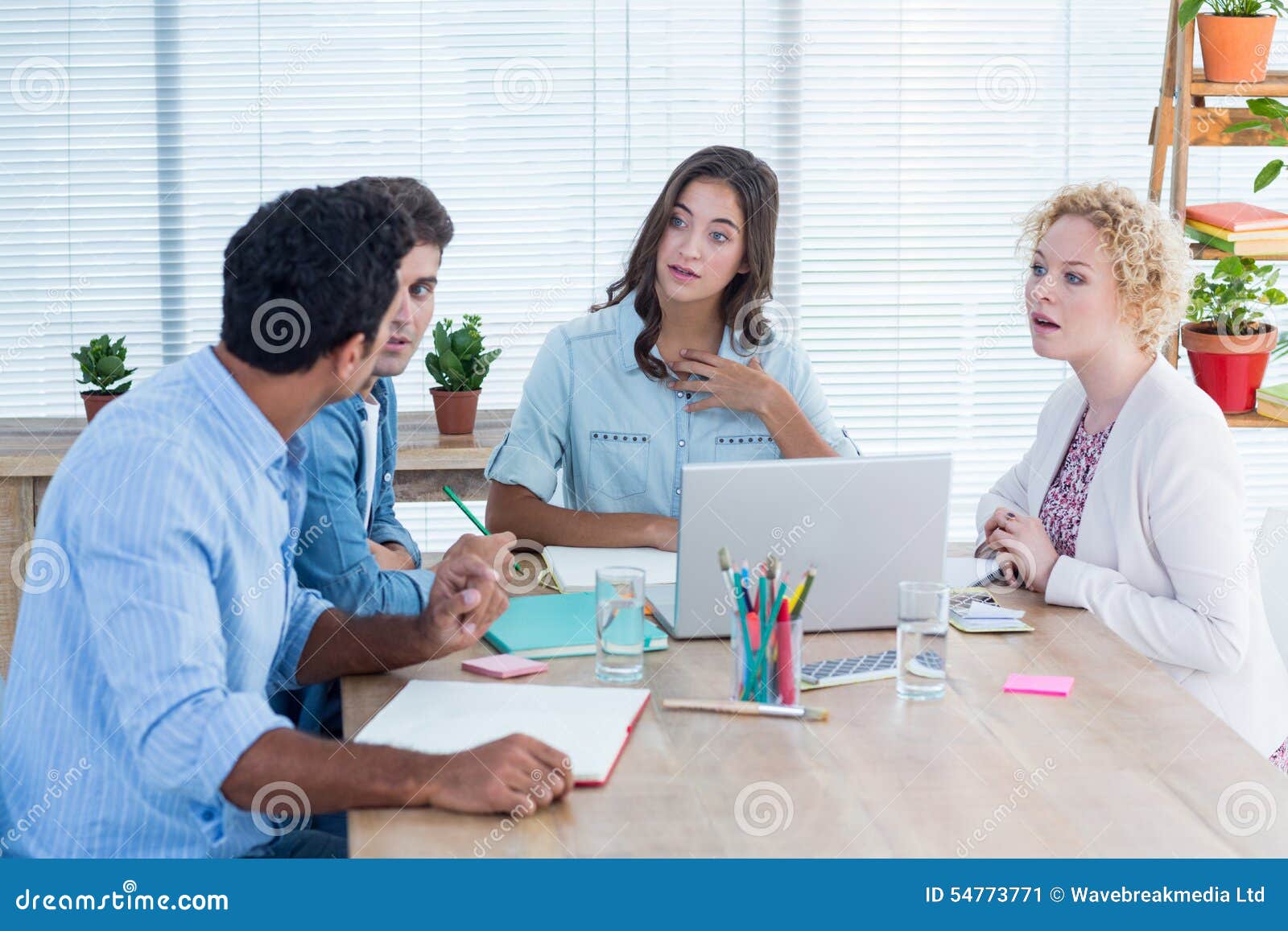 Group of Young Colleagues Using Laptop Stock Image - Image of four ...