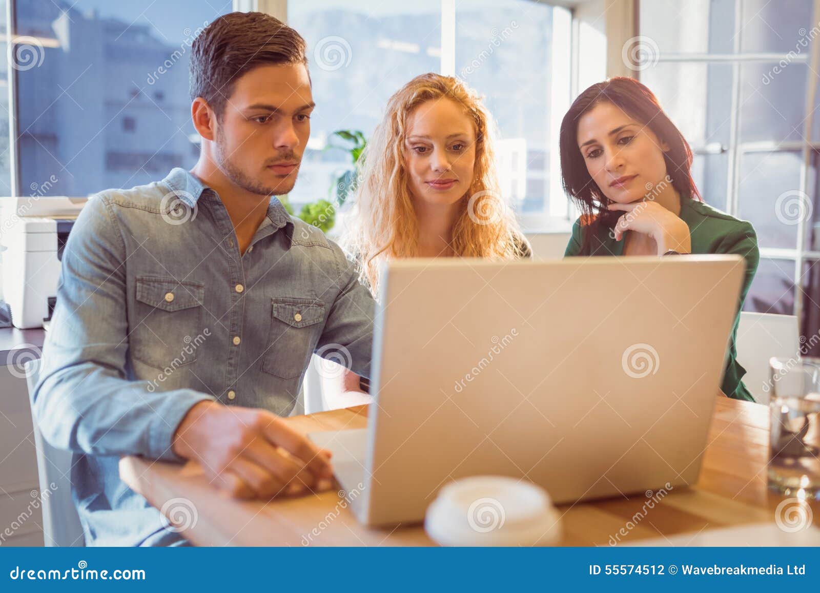 Group of Young Colleagues Using Laptop Stock Photo - Image of corporate ...