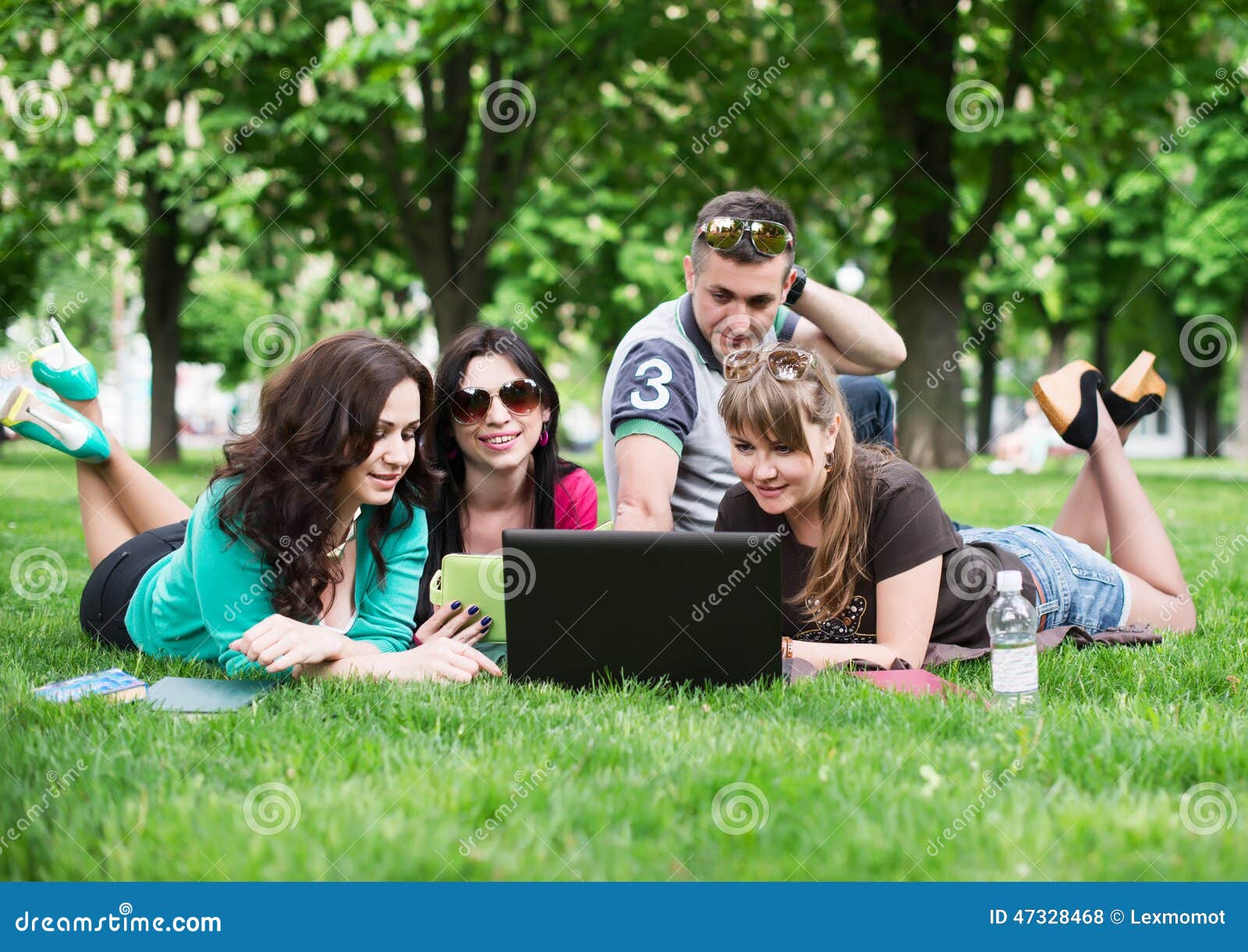 Group of Young College Students Sitting on Grass Stock Photo - Image of ...