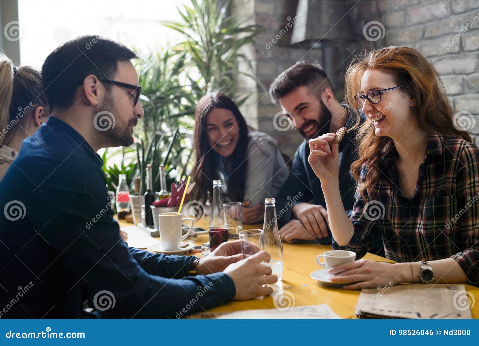 Group of Young Coworkers Socializing in Restaurant Stock Photo - Image ...