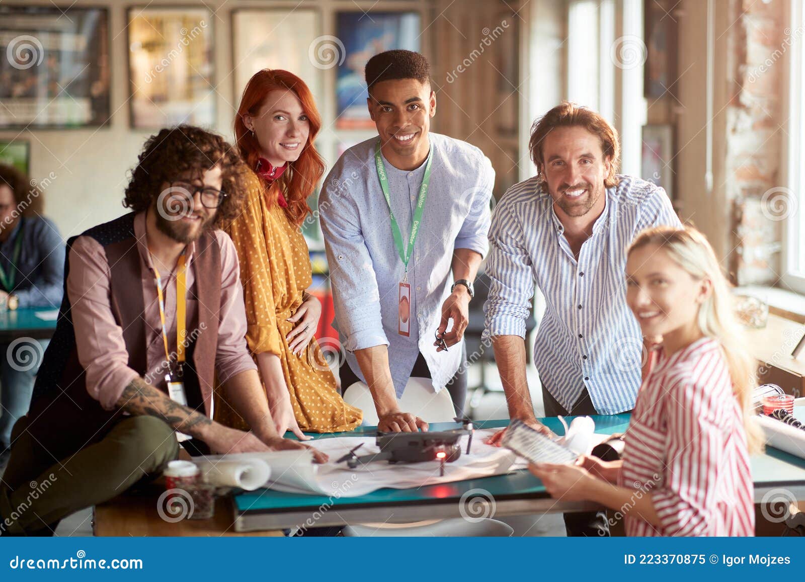 Group of Young Creative People is Posing for a Photo at Work in the ...
