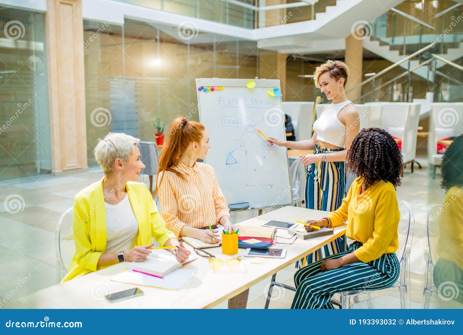 Group of Young Designers Collaborating on Project in Office Stock Photo ...