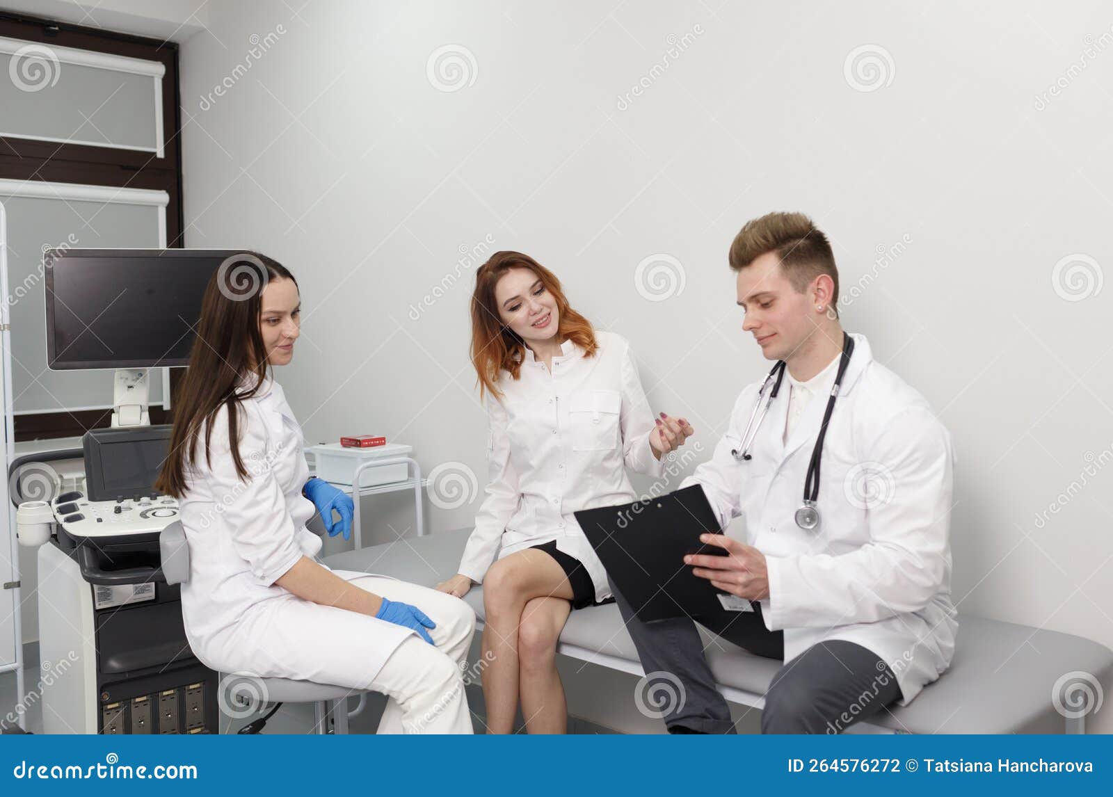 A Group of Young Doctors Communicate with Each Other Sitting in the ...