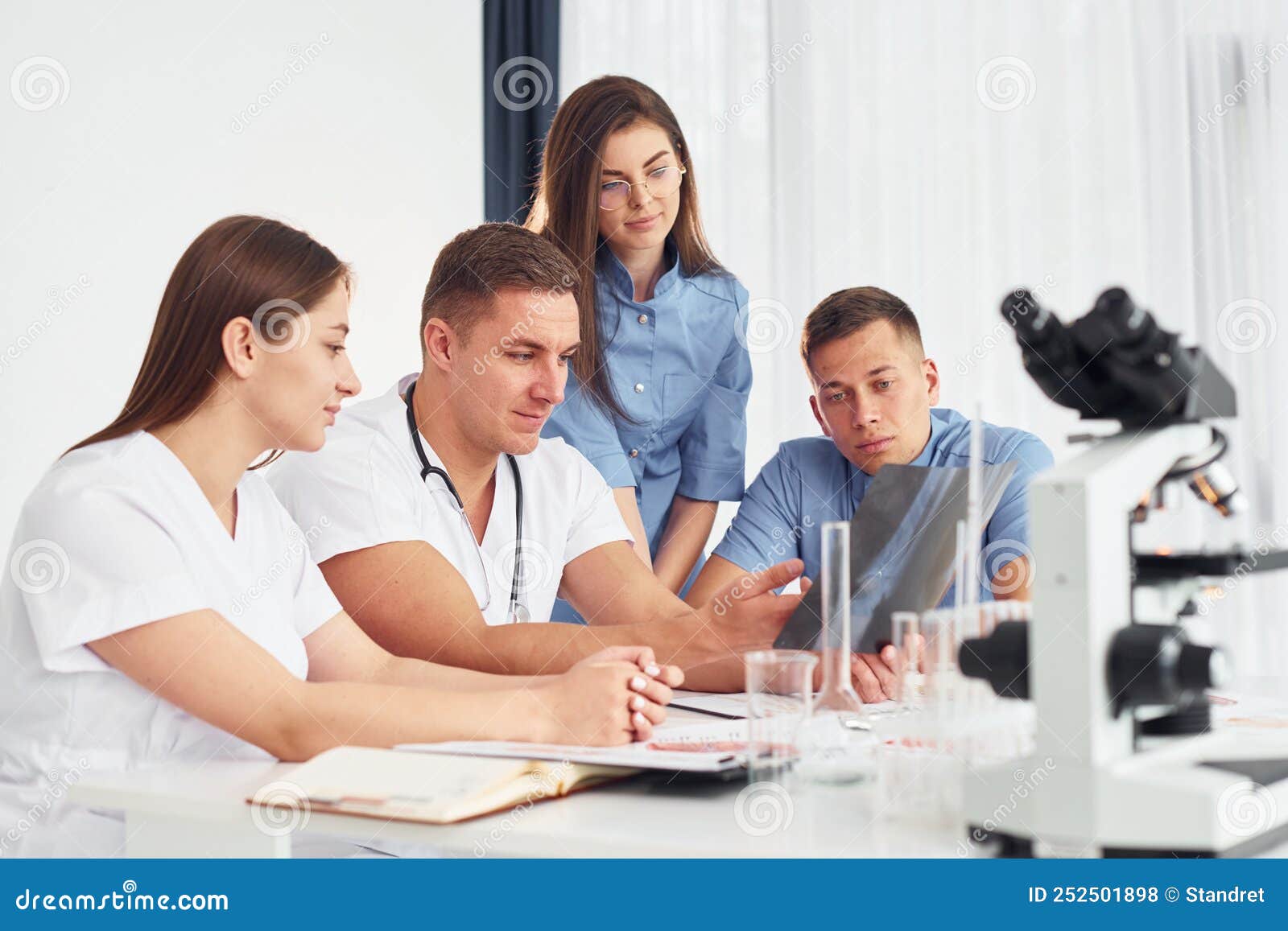 Group of Young Doctors is Working Together in the Modern Office Stock ...