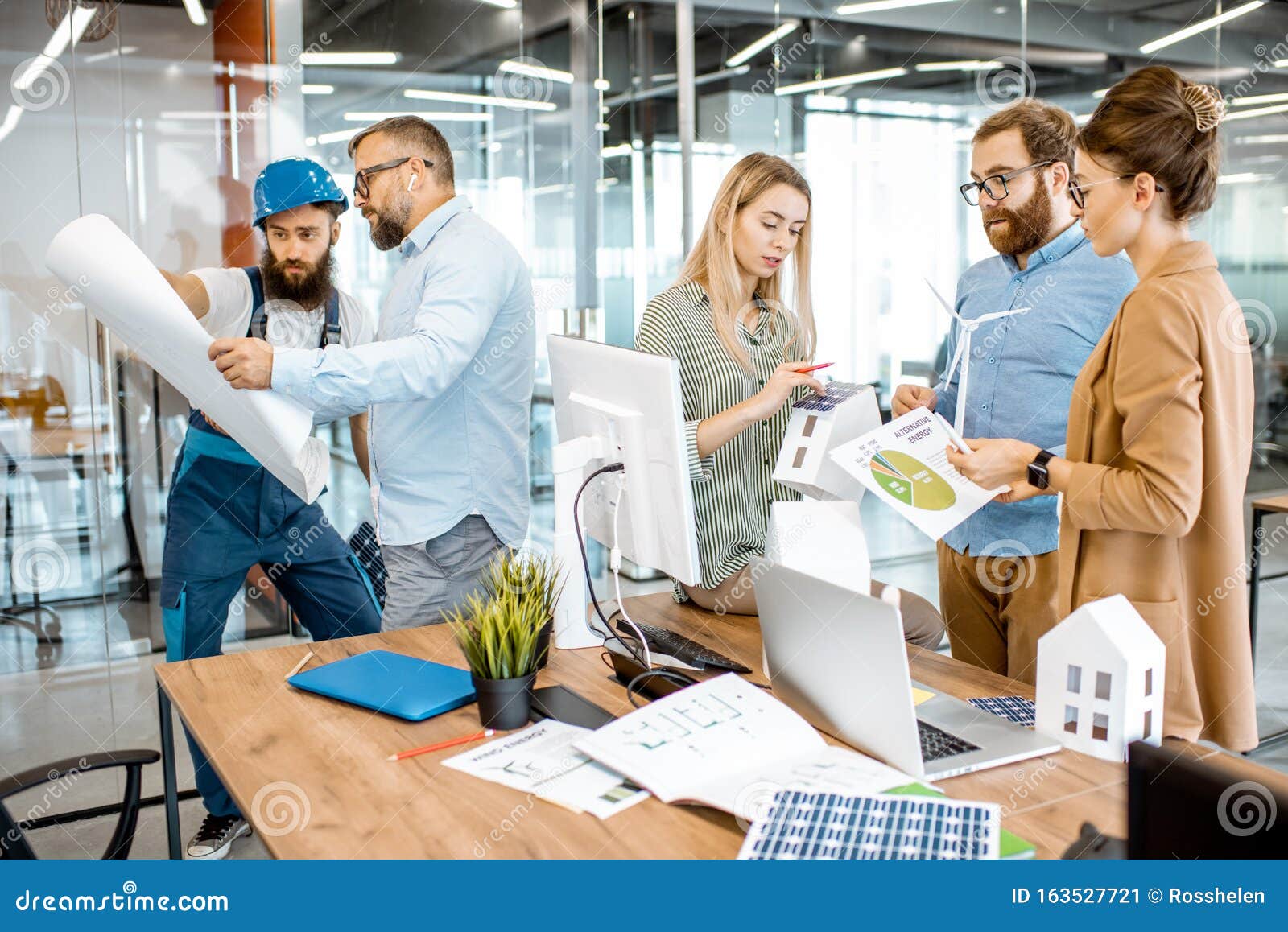 Group of People Working on Alternative Energy Project in the Office ...