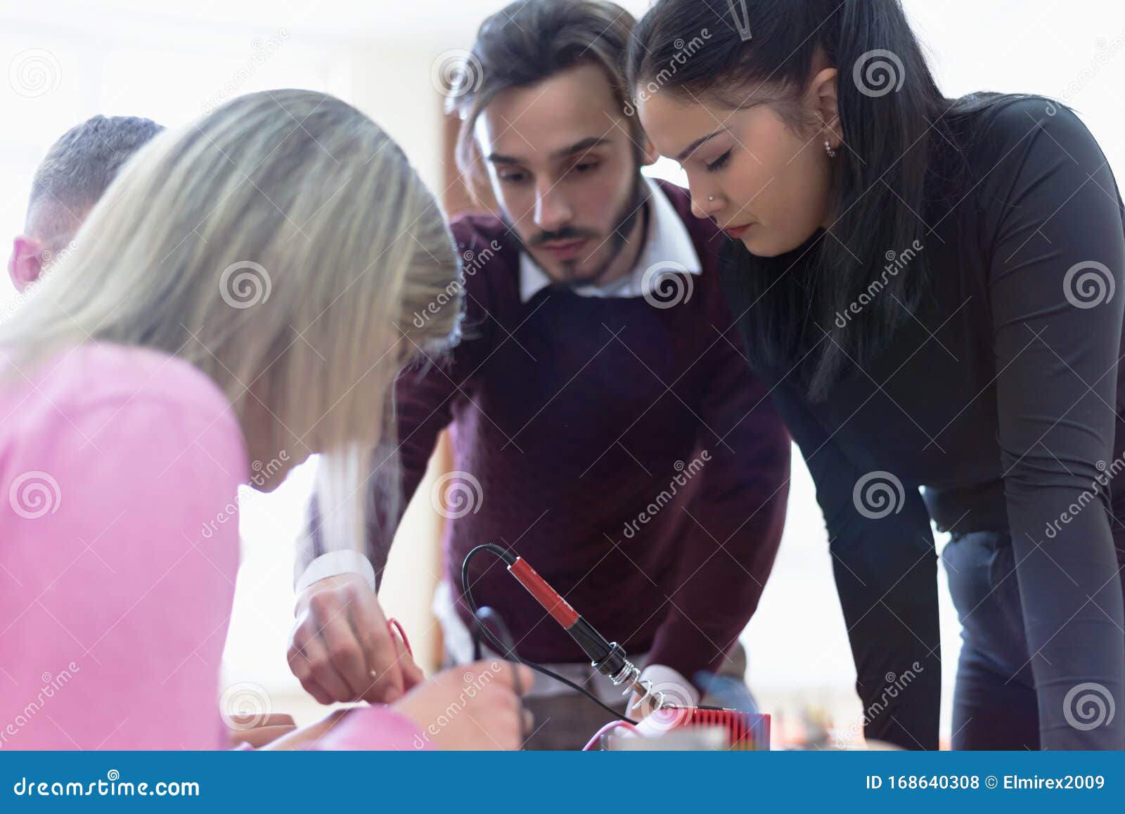 Group of Young Engineers Working on Robotics Project. Scientist ...
