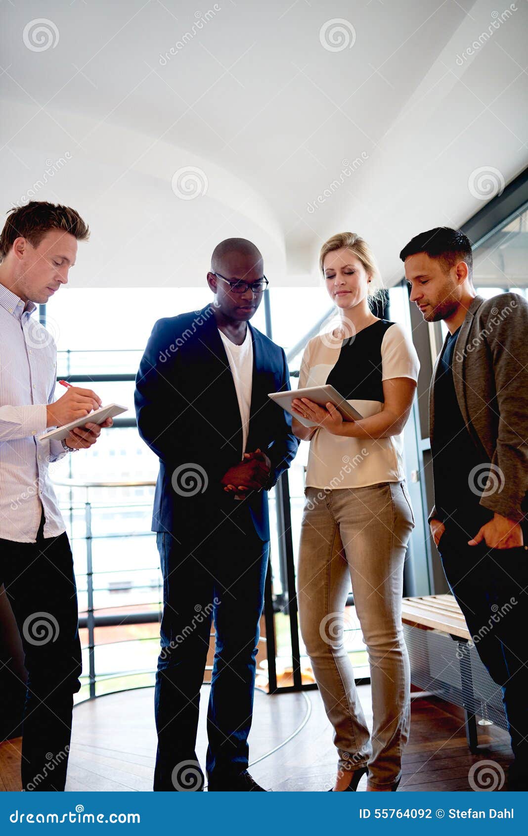 Group of Young Executives Gathered at Work. Stock Photo - Image of ...