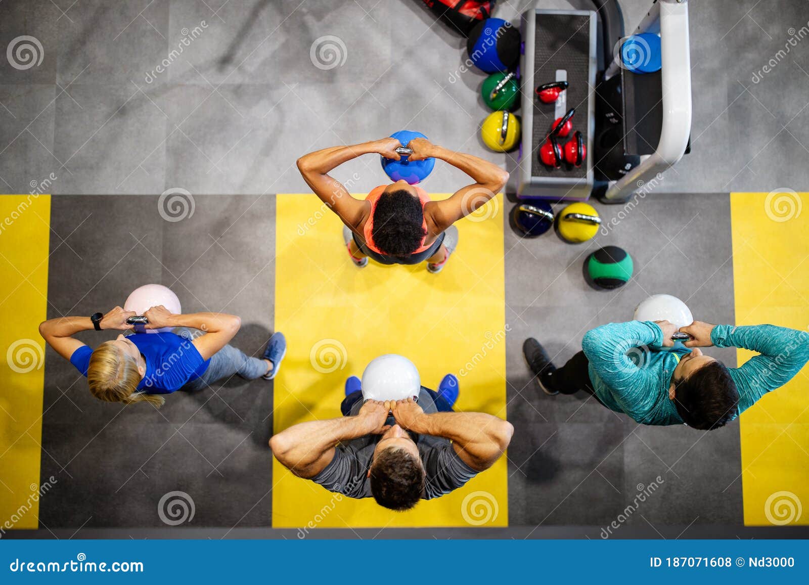 Group of Young Friends People Doing Exercises in Gym Stock Photo ...
