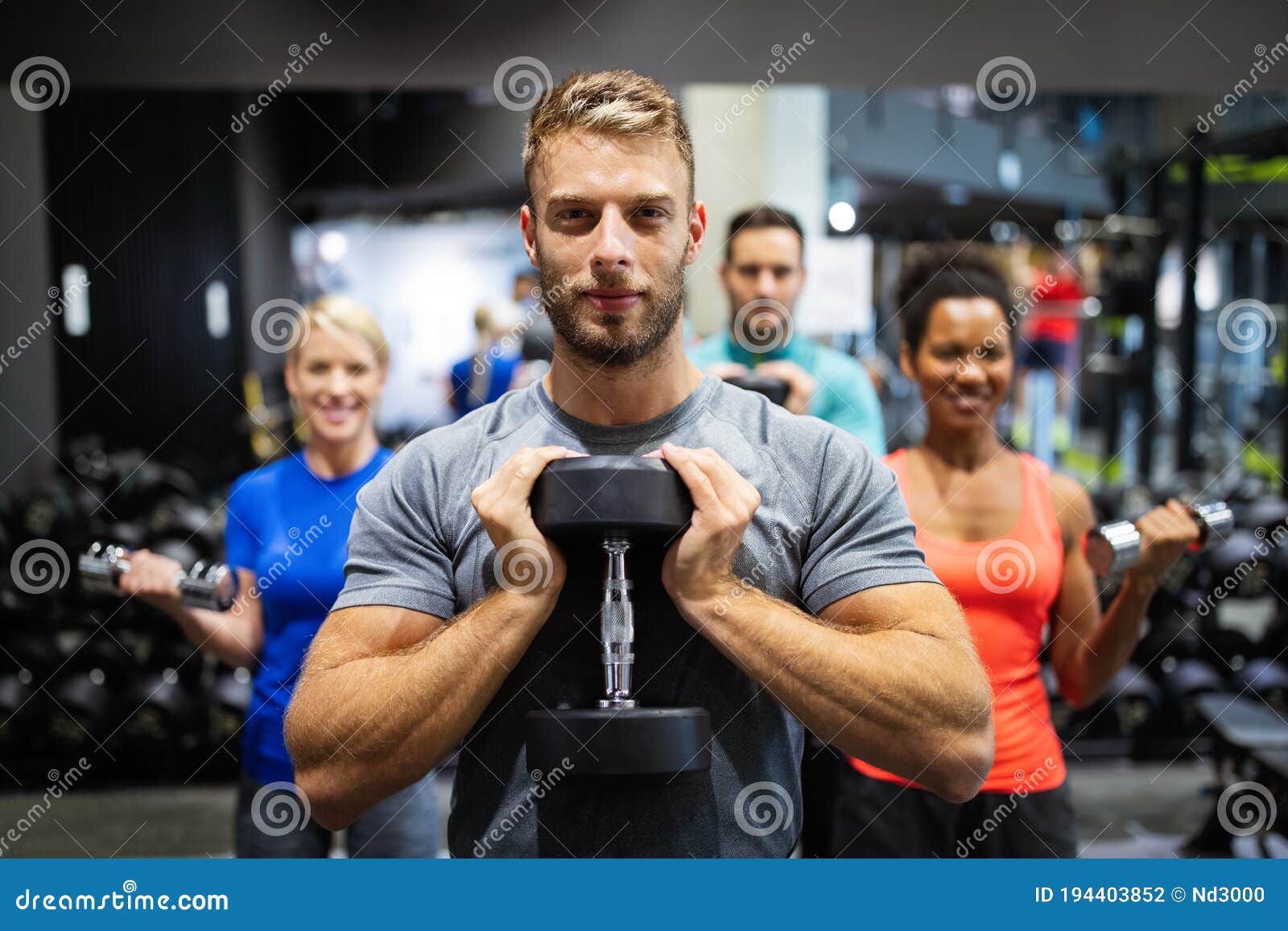 Group of Young Friends People Doing Exercises in Gym Stock Photo ...