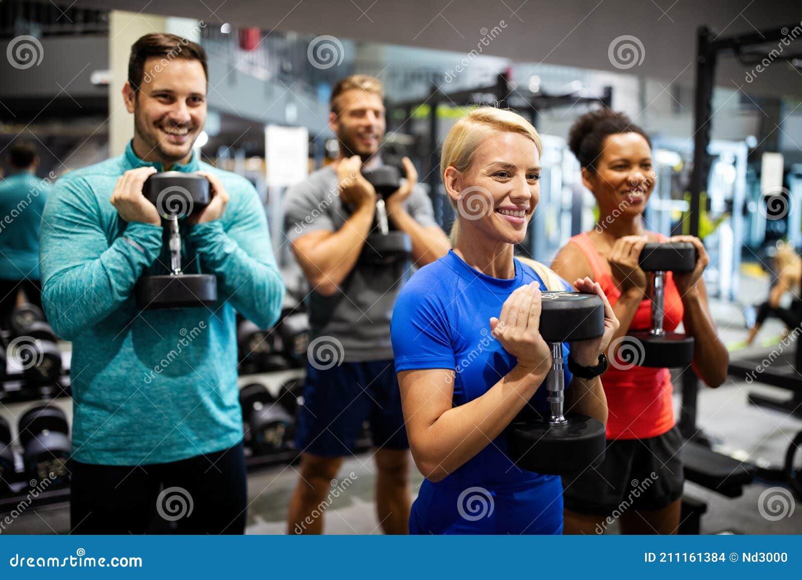 Group of Young Friends People Doing Exercises in Gym Stock Photo ...