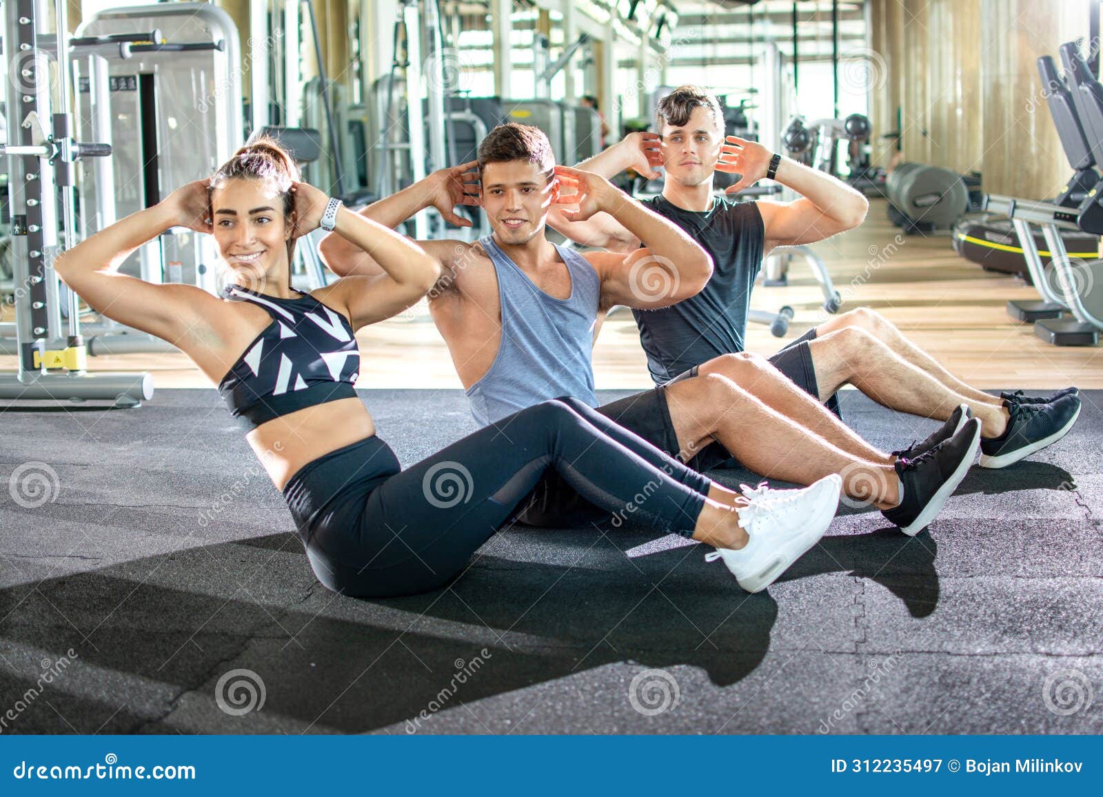 Group of Young Fit People Doing Crunches at Gym. Stock Image - Image of ...