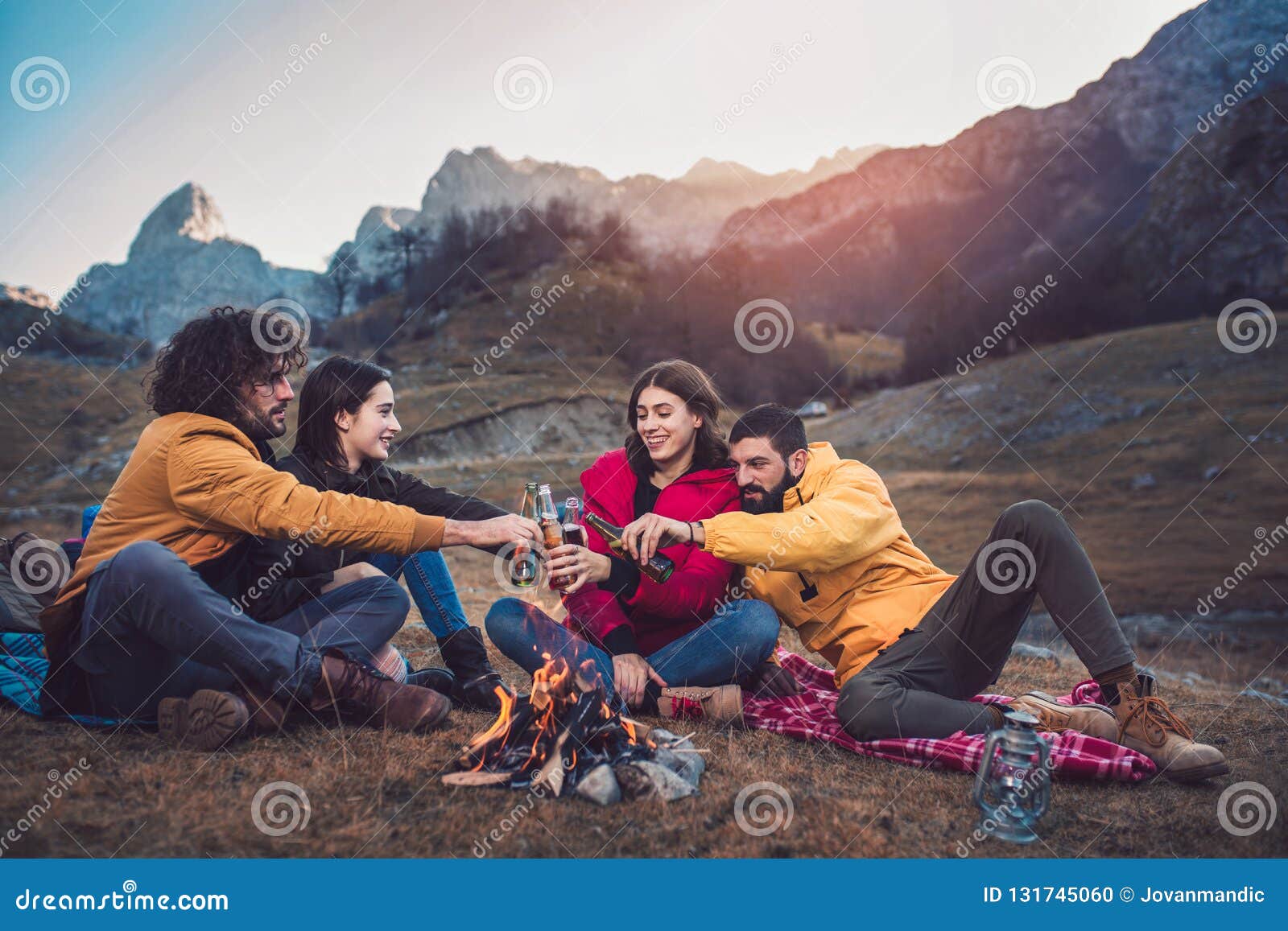 Group of Young Friends Around Camp Fire Stock Photo - Image of girl ...