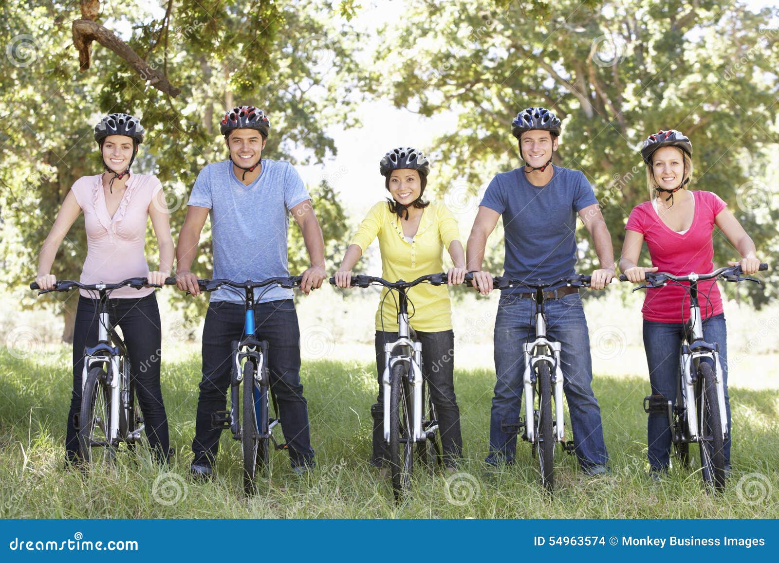 Group of Young Friends on Cycle Ride in Countryside Stock Photo - Image ...