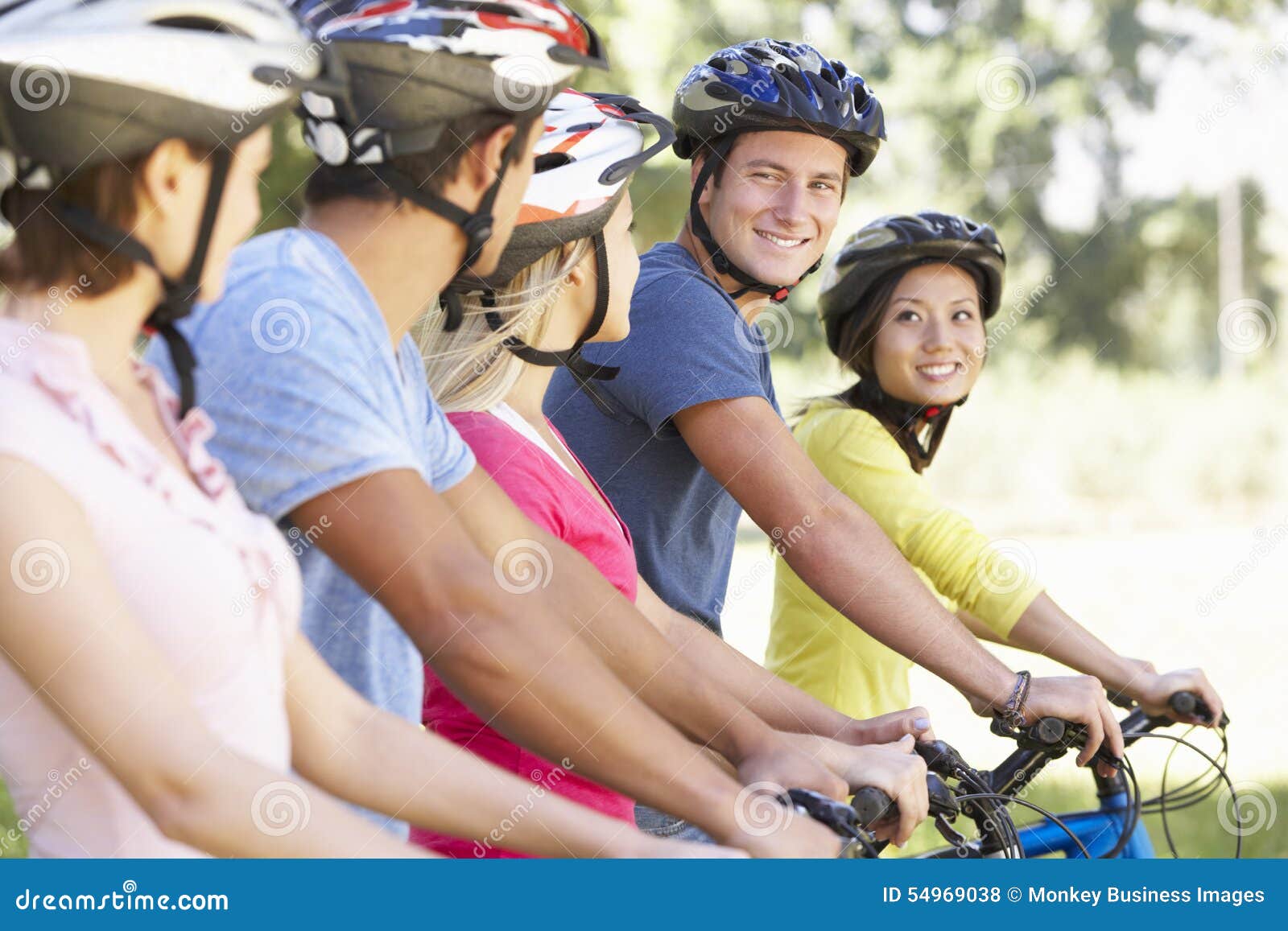 Group of Young Friends on Cycle Ride in Countryside Stock Photo - Image ...