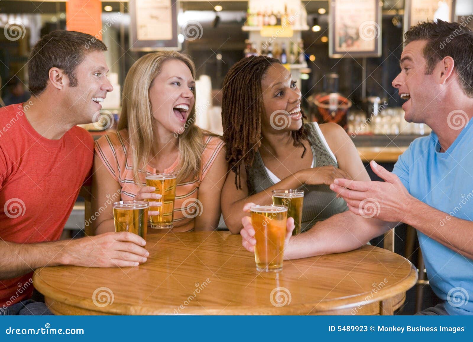 Group of Young Friends Drinking and Laughing Stock Image - Image of ...