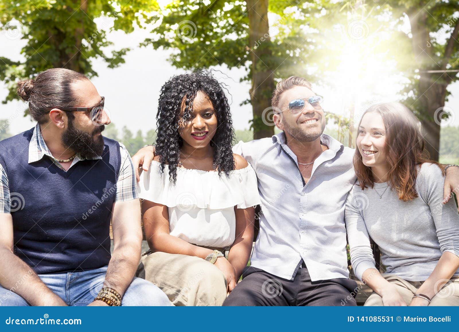 Group of Young Friends Have Fun Sitting on a Bench Stock Image - Image ...