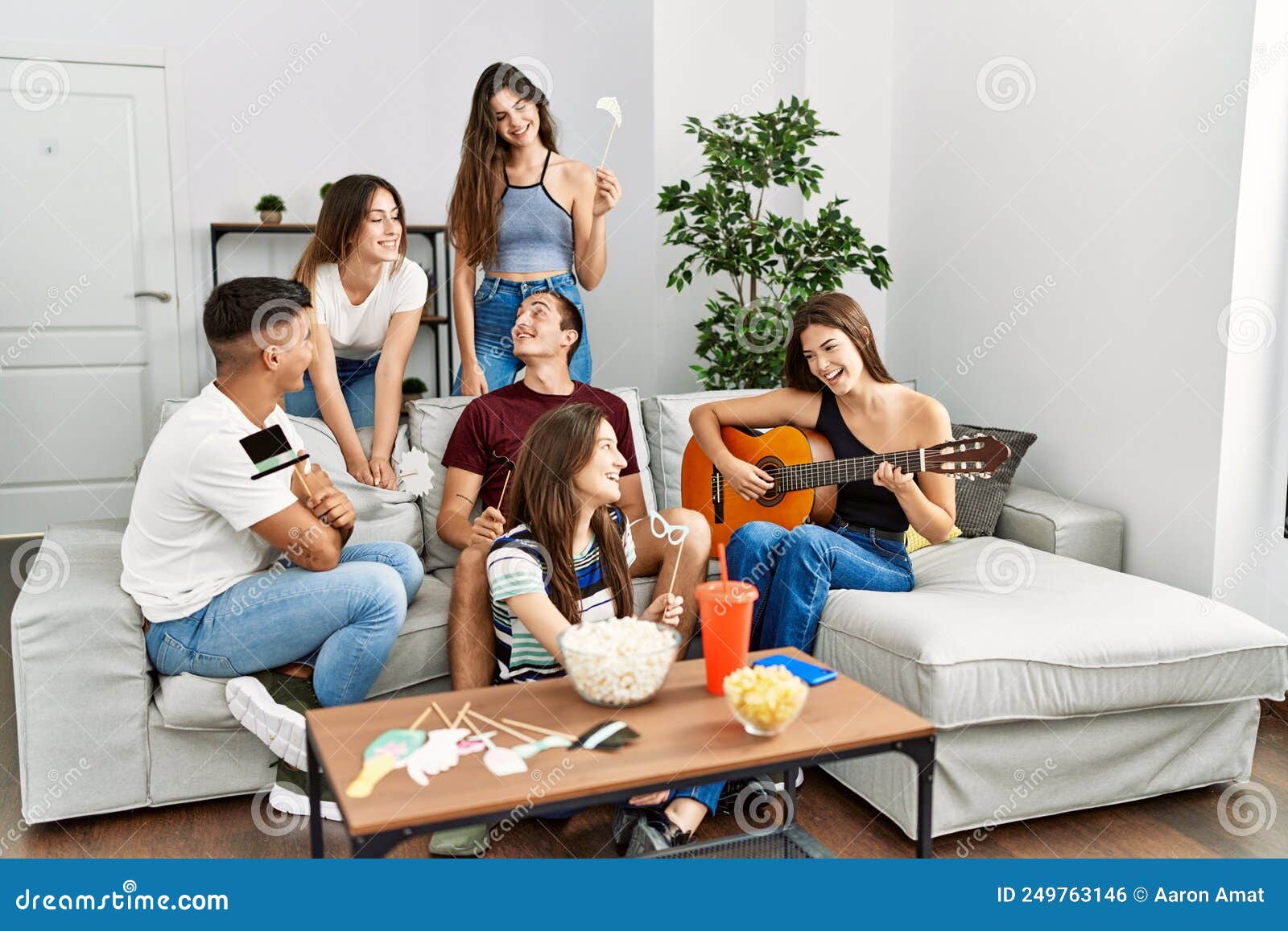 Group of Young Friends Having Party Playing Classical Guitar at Home ...