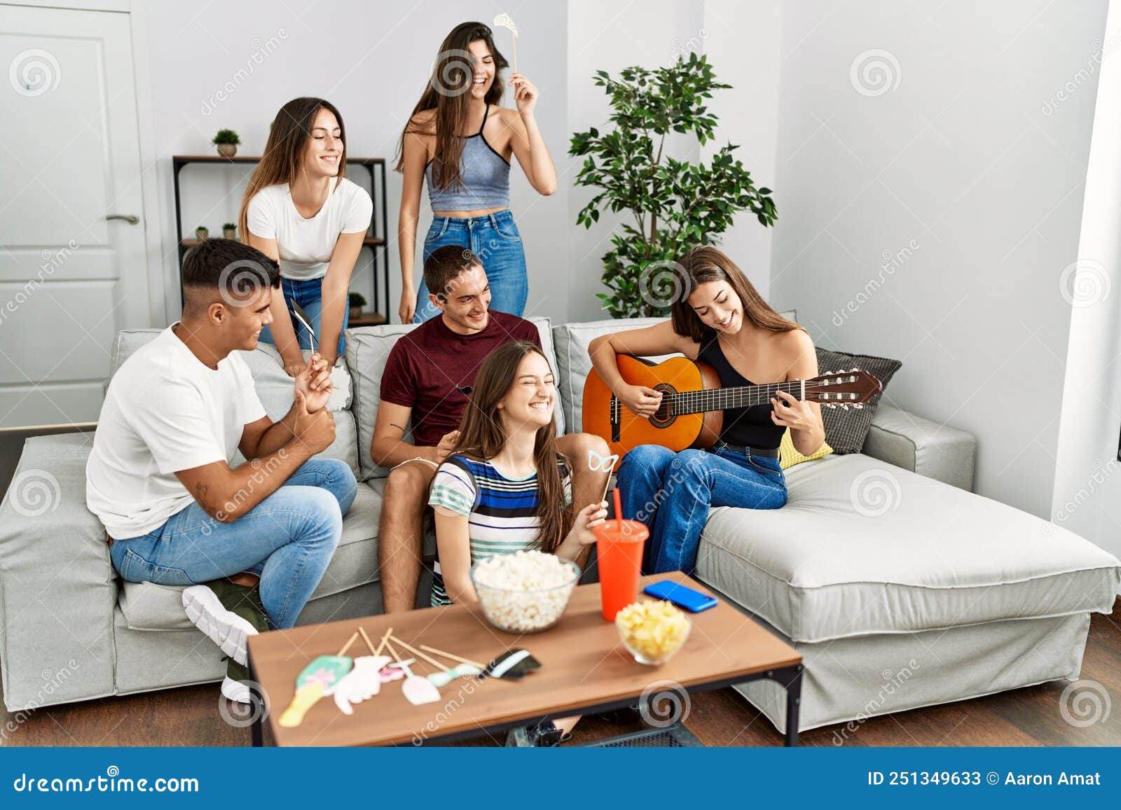 Group of Young Friends Having Party Playing Classical Guitar at Home ...