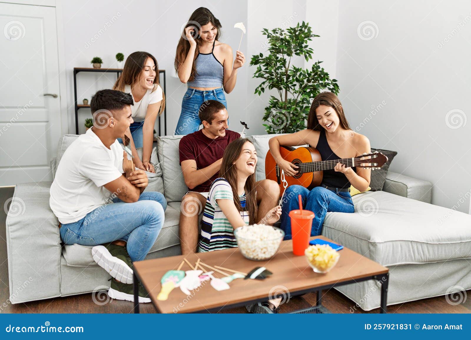Group of Young Friends Having Party Playing Classical Guitar at Home ...