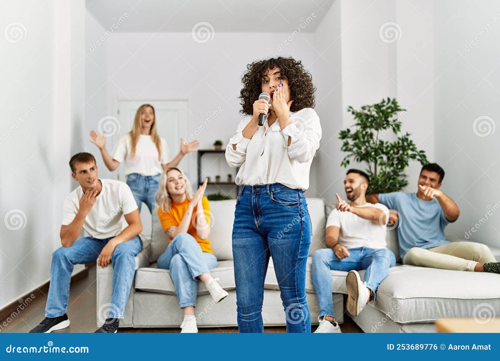 Group of Young Friends Having Party Singing Song Using Microphone at ...