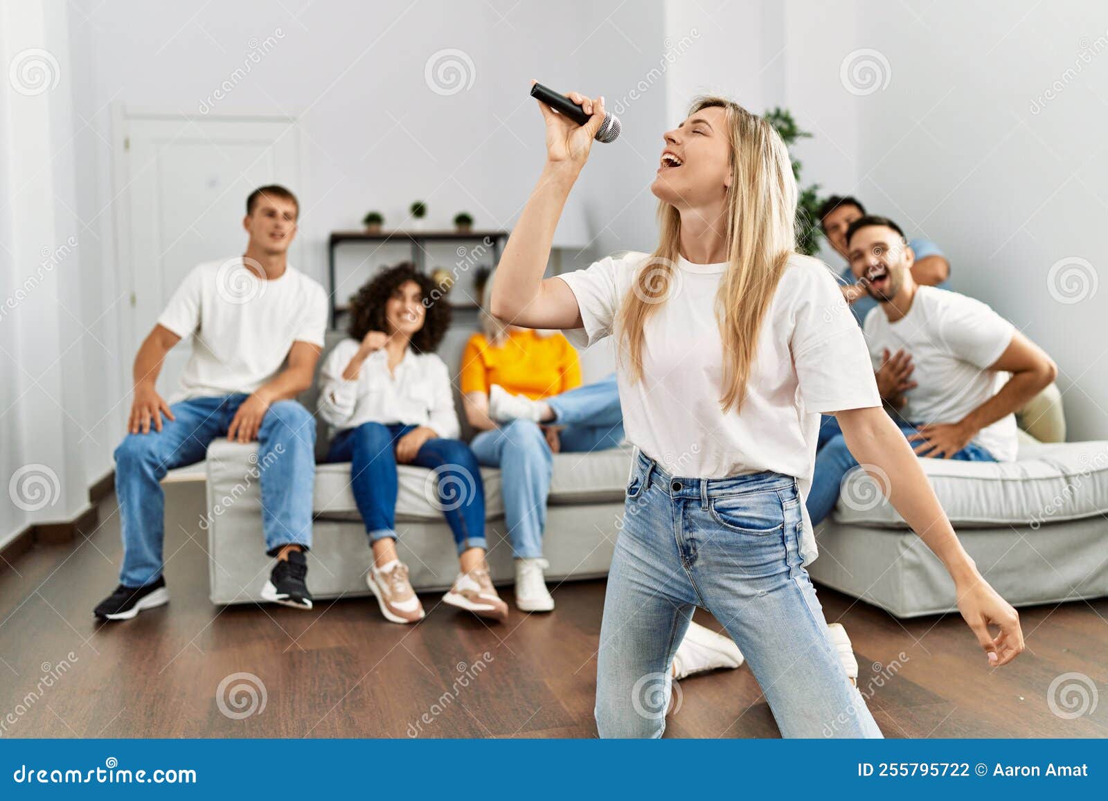 Group of Young Friends Having Party Singing Song Using Microphone at ...