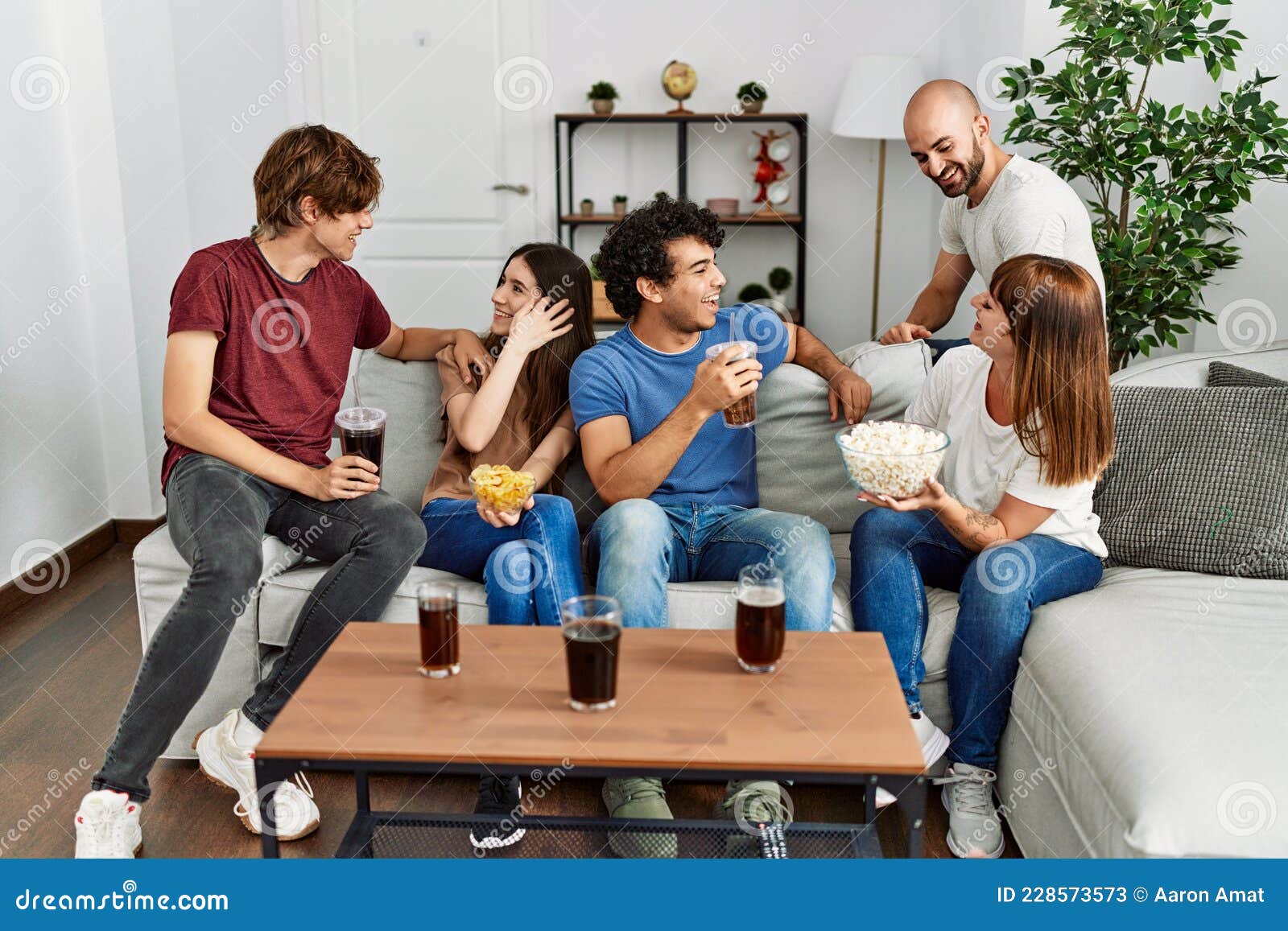 Group of Young Friends Having Party Sitting on the Sofa at Home Stock ...