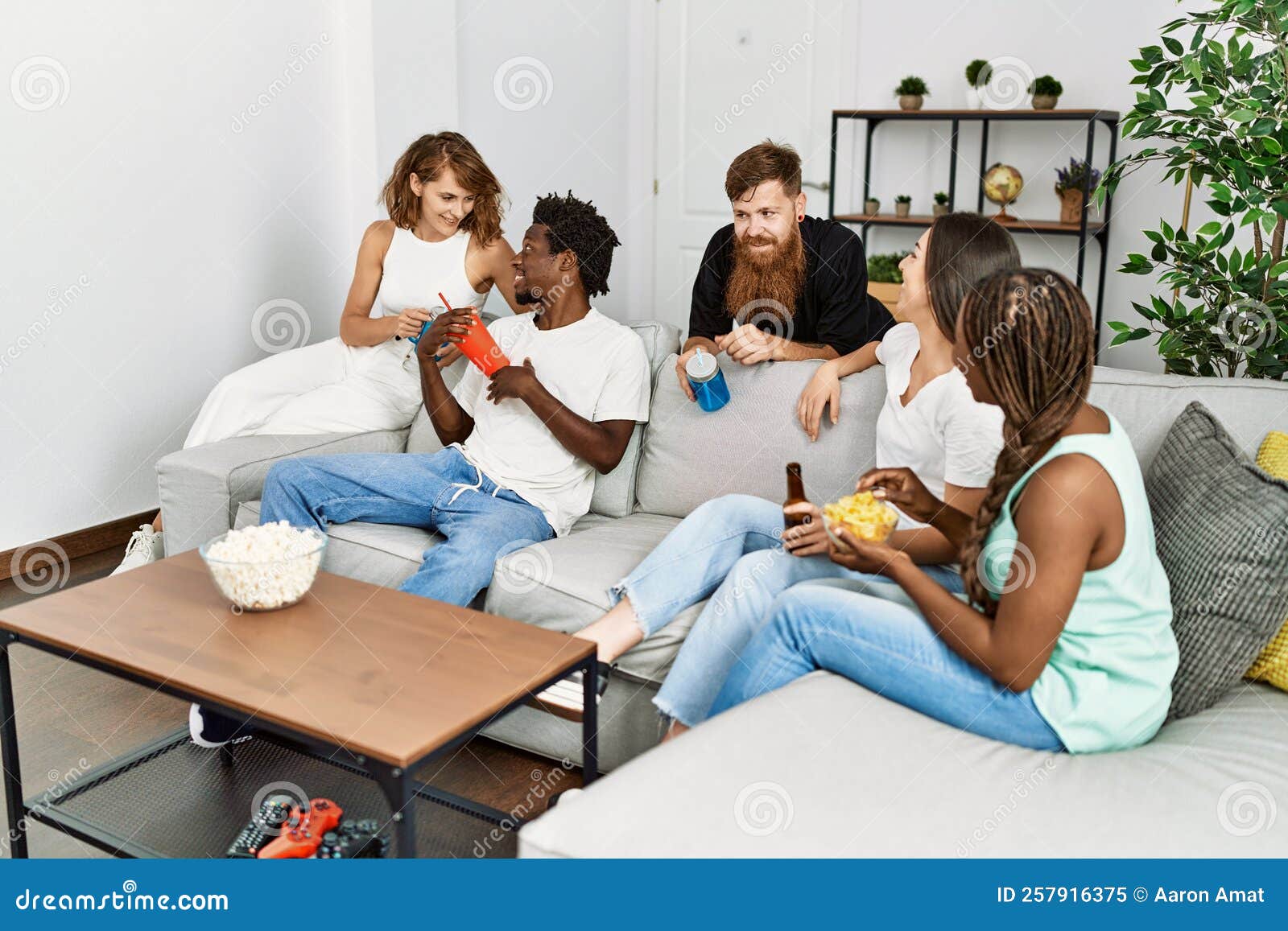 Group of Young Friends Having Party Sitting on the Sofa at Home Stock ...