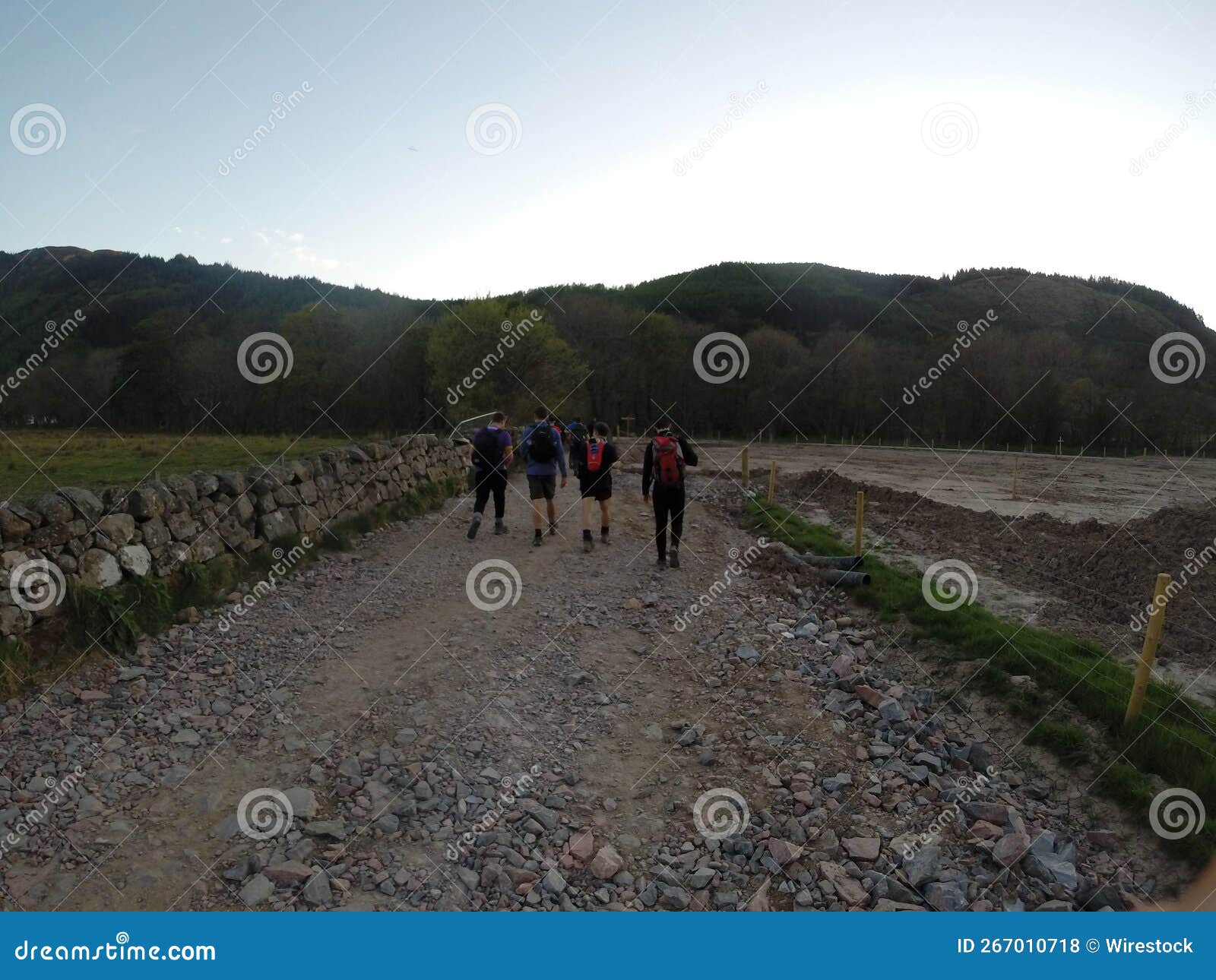 Group of Young Friends Hiking on the Stone Paths in the Mountains Stock ...