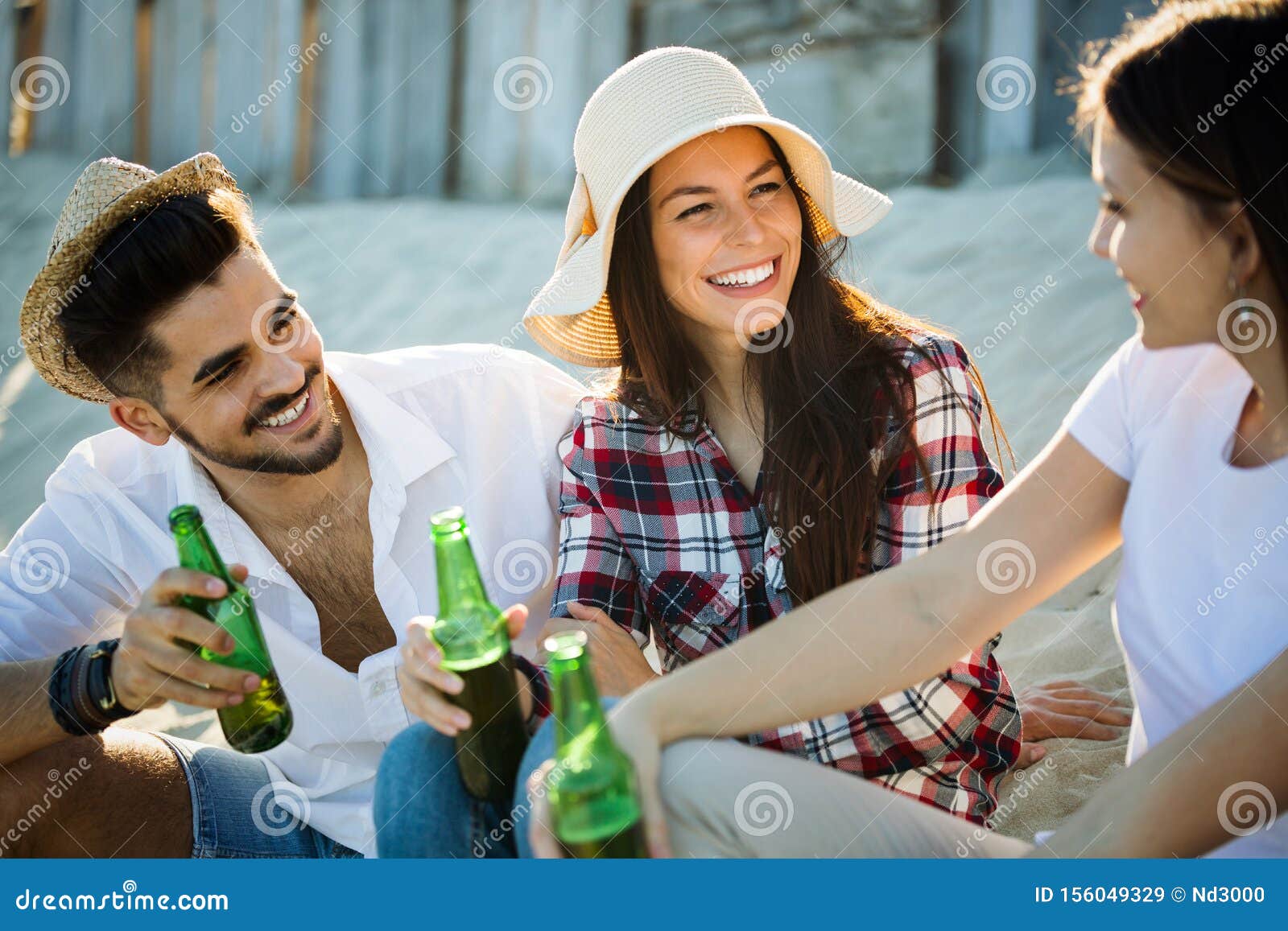 Group of Young Friends Laughing and Drinking Beer Stock Image - Image ...