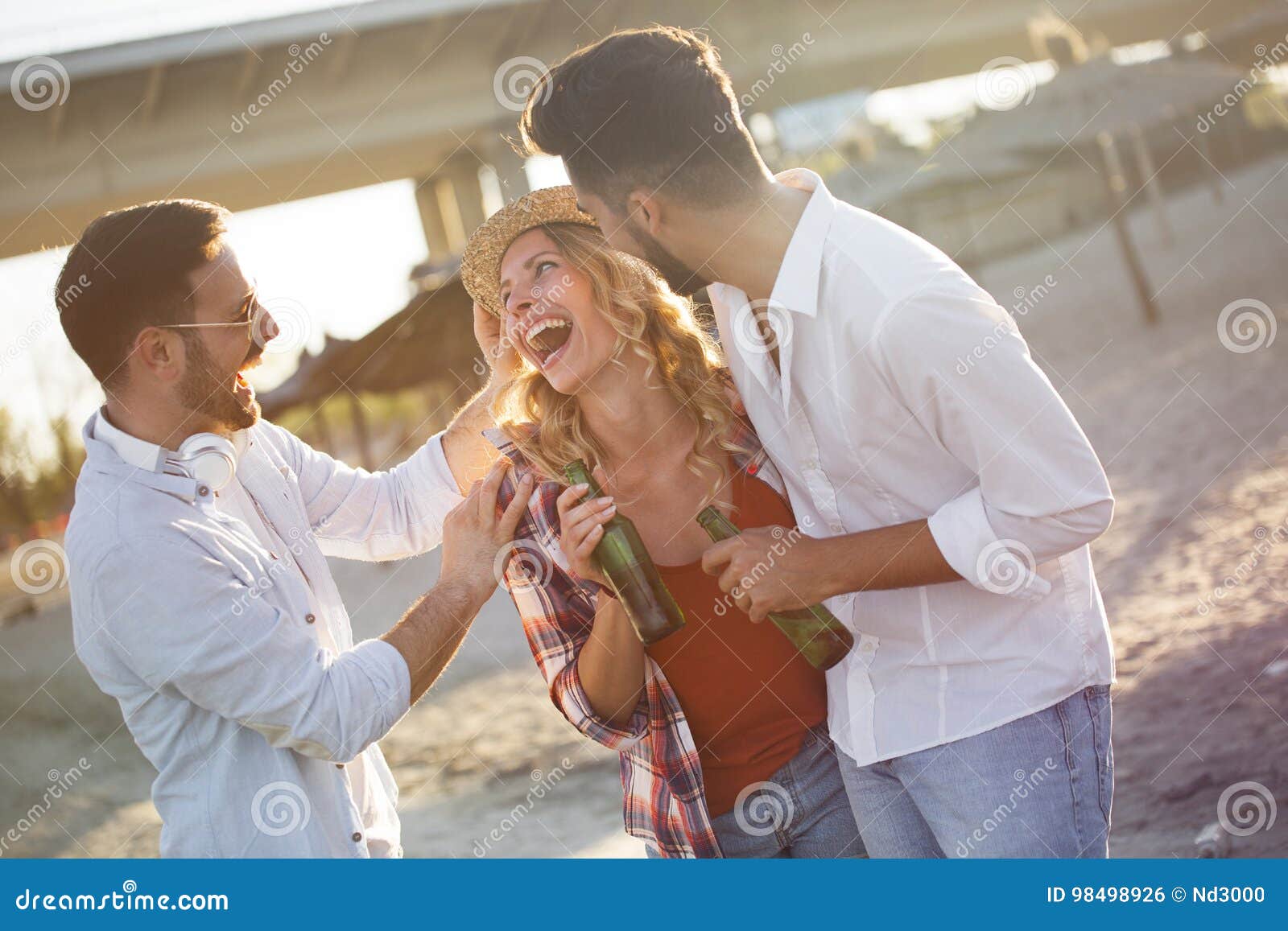 Group of Young Friends Laughing and Drinking Beer Stock Photo - Image ...
